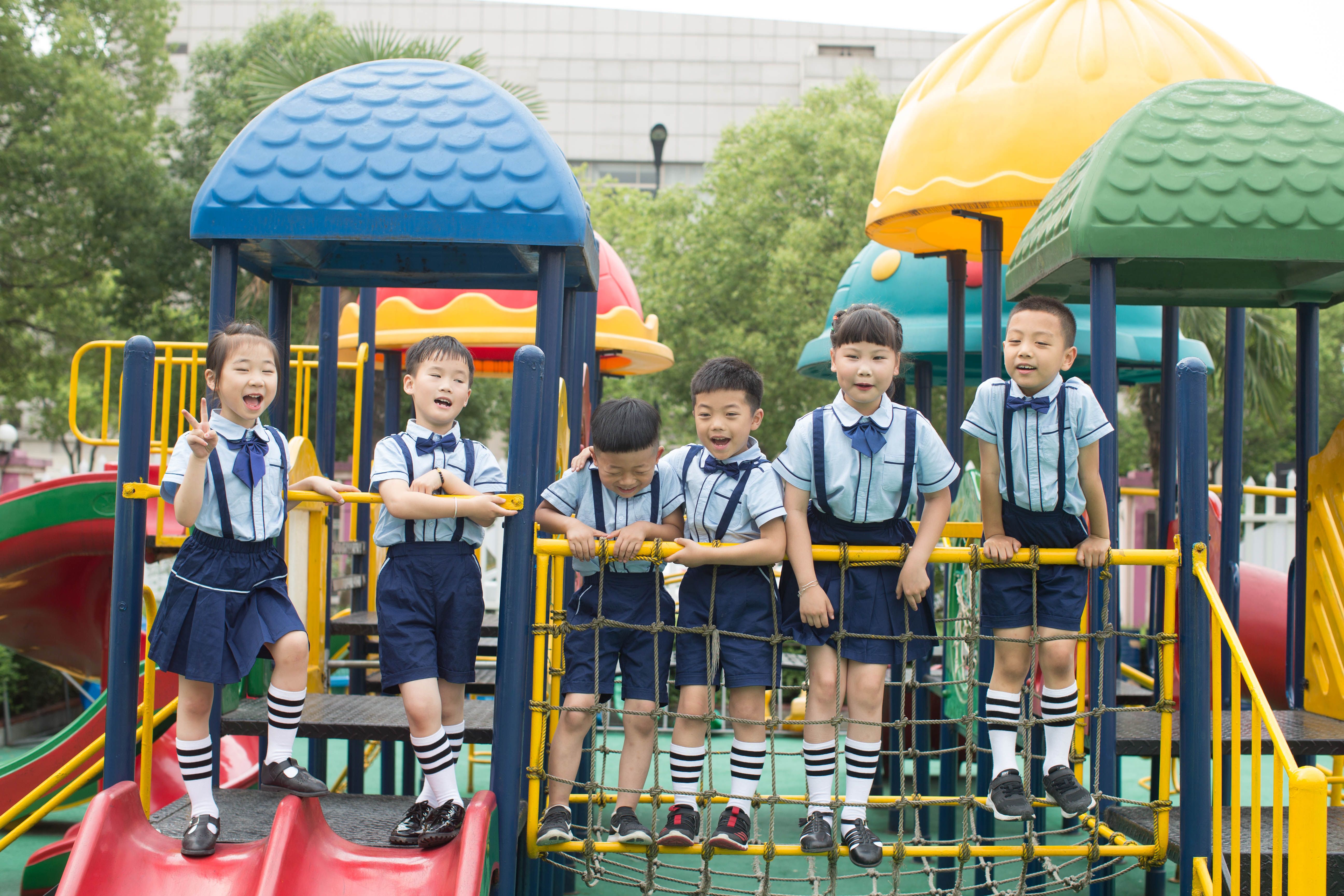 Children Playing on Colorful Playground Equipment · Free Stock Photo