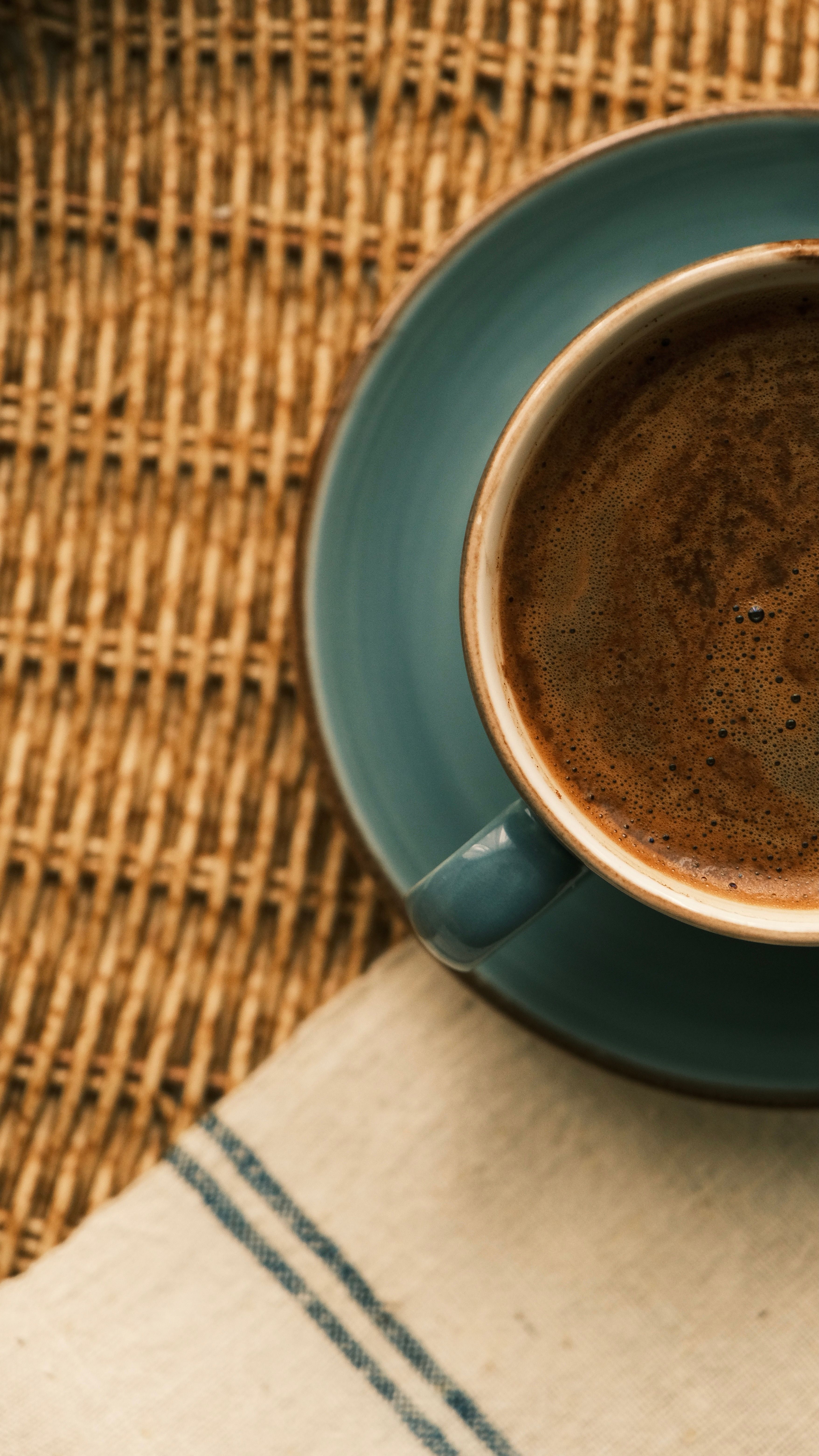 Aerial Top View of Coffee Cup on Woven Surface · Free Stock Photo