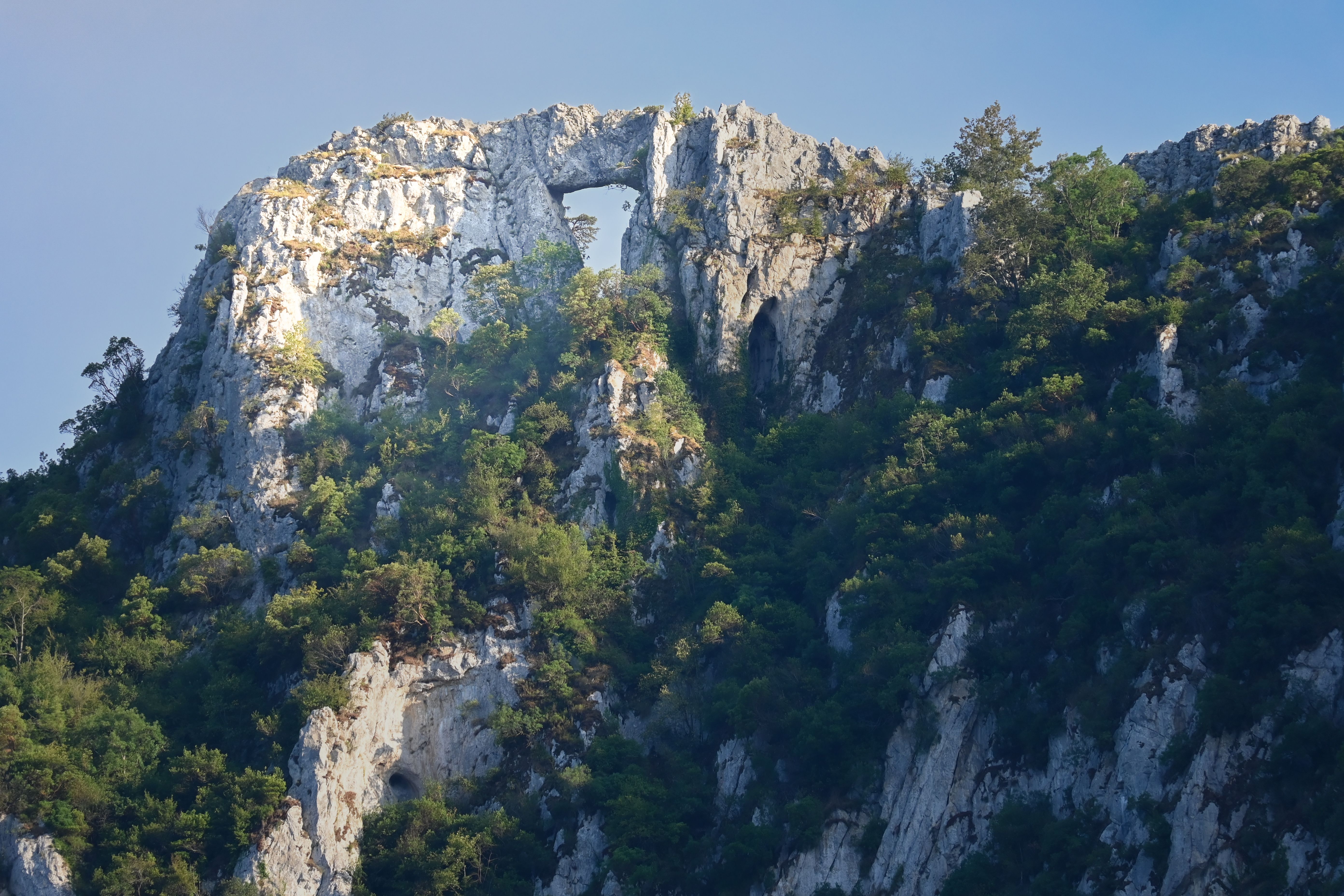 Stunning Limestone Arch in Rugged Mountain Landscape · Free Stock Photo