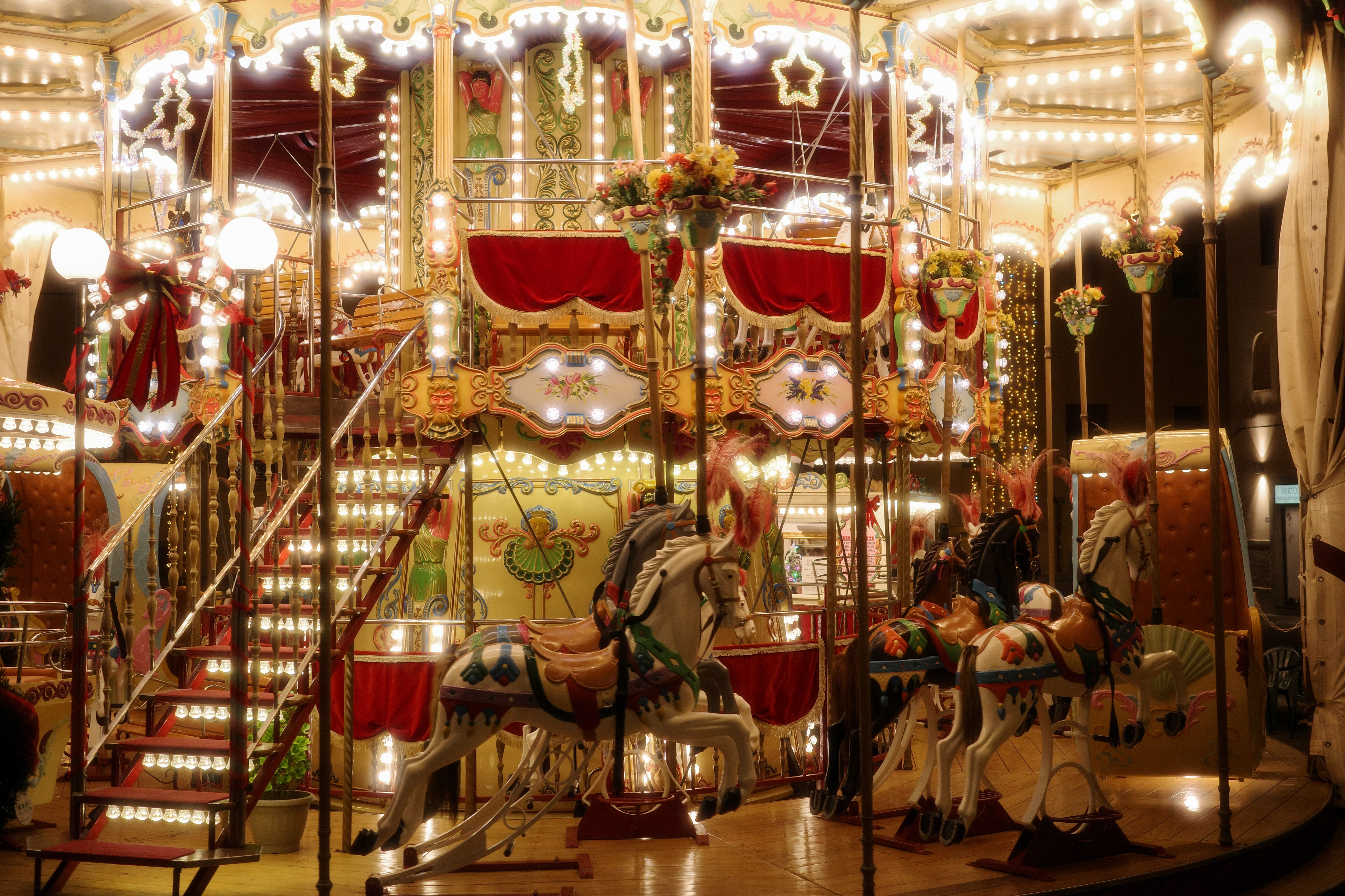 Nighttime Carousel with Bright Lights and Horses · Free Stock Photo