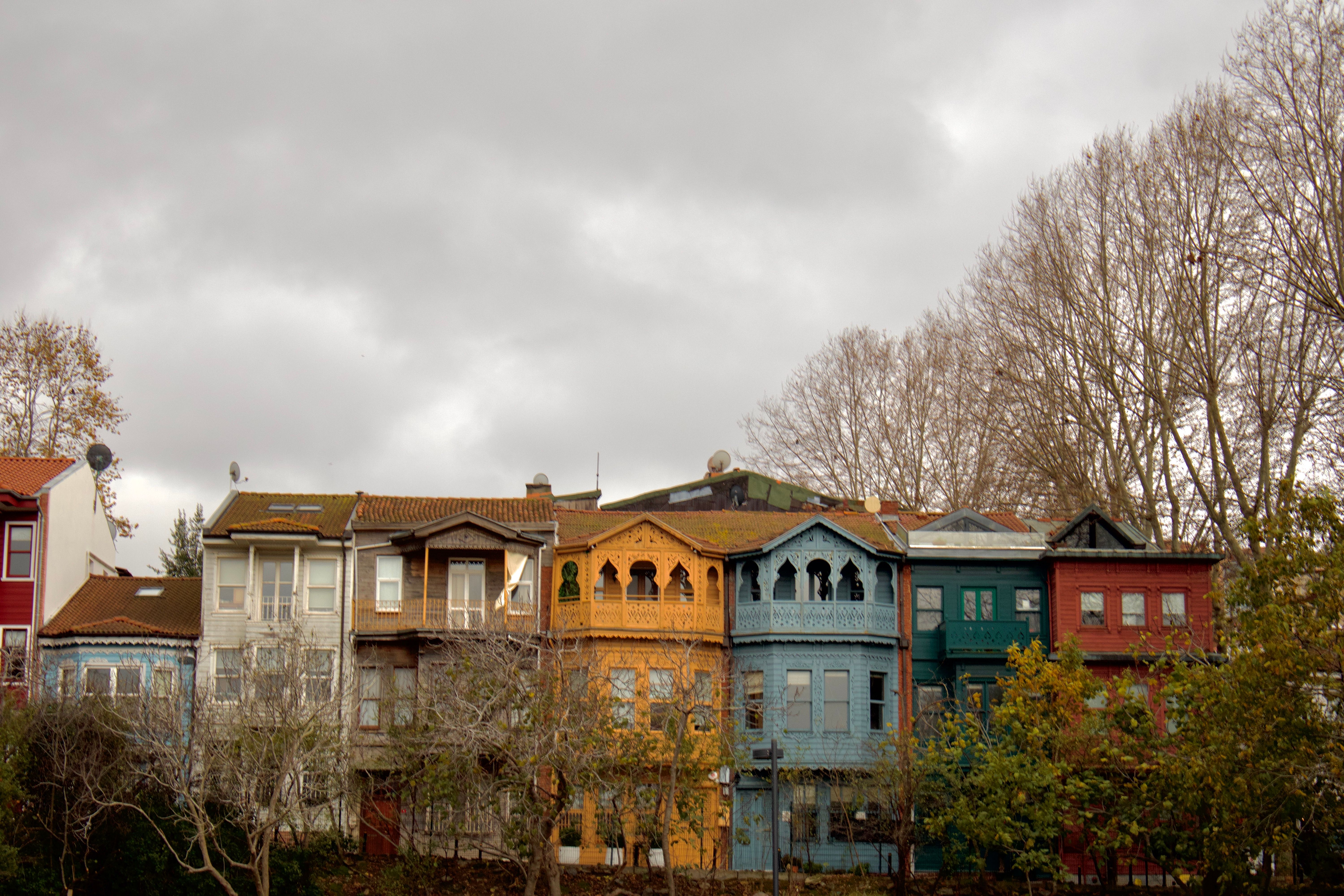 Colorful Historic Houses Under Cloudy Sky · Free Stock Photo