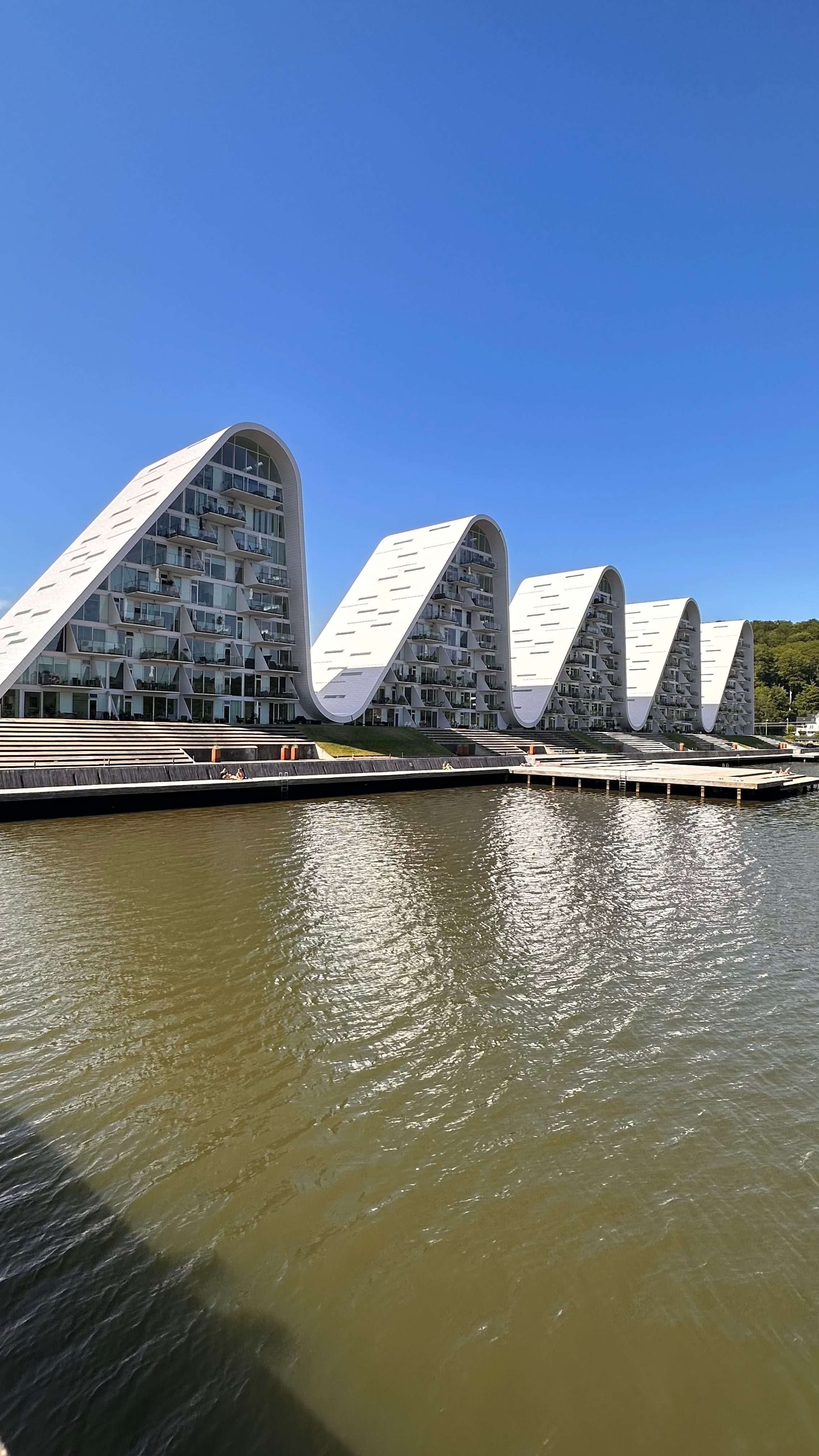 Modern Architectural Waves by Waterfront · Free Stock Photo