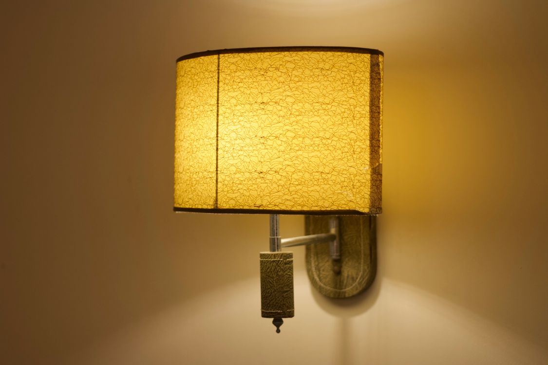 Warm Wall Lighting with Textured Lampshade · Free Stock Photo