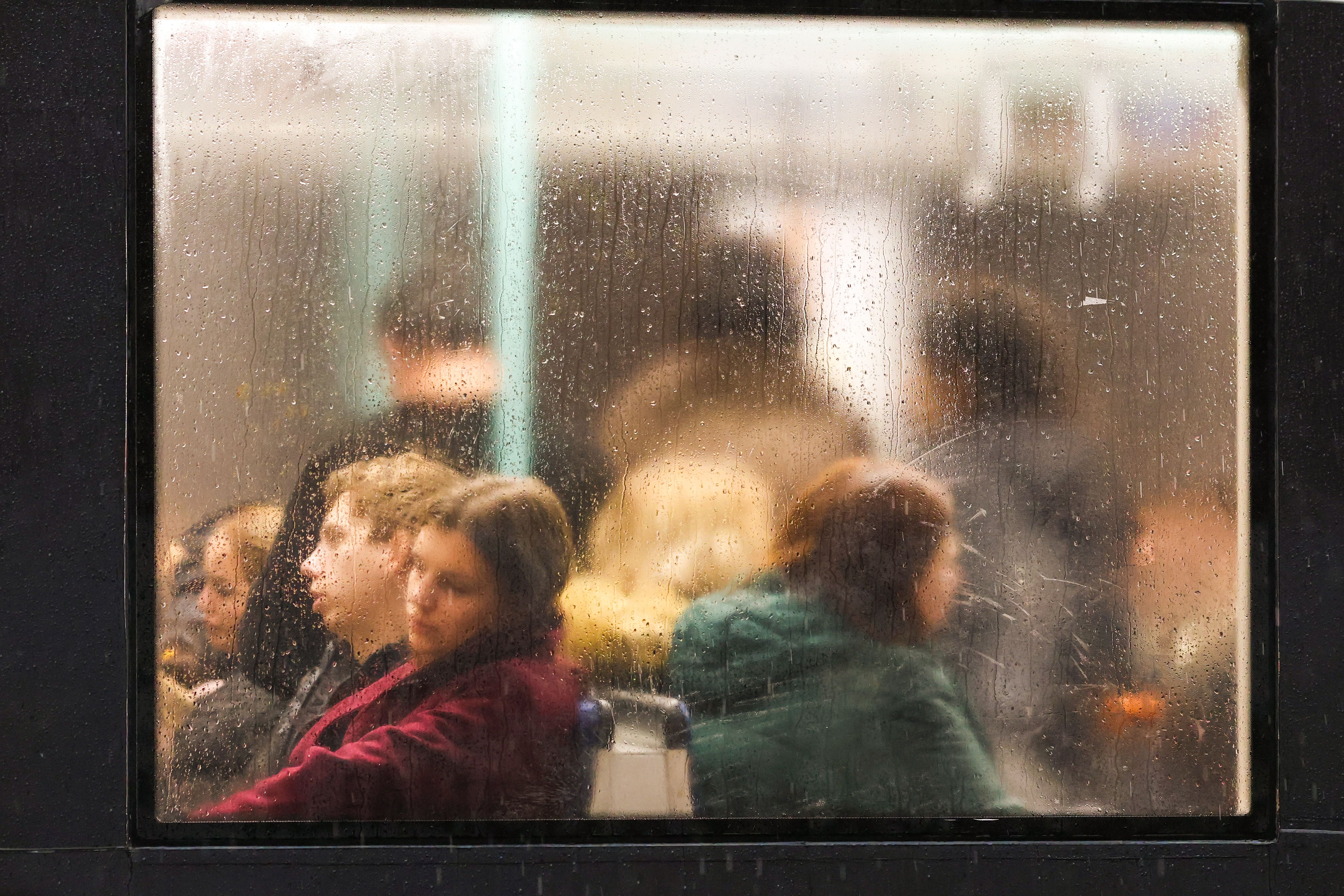 Rainy day candid subway window scene · Free Stock Photo