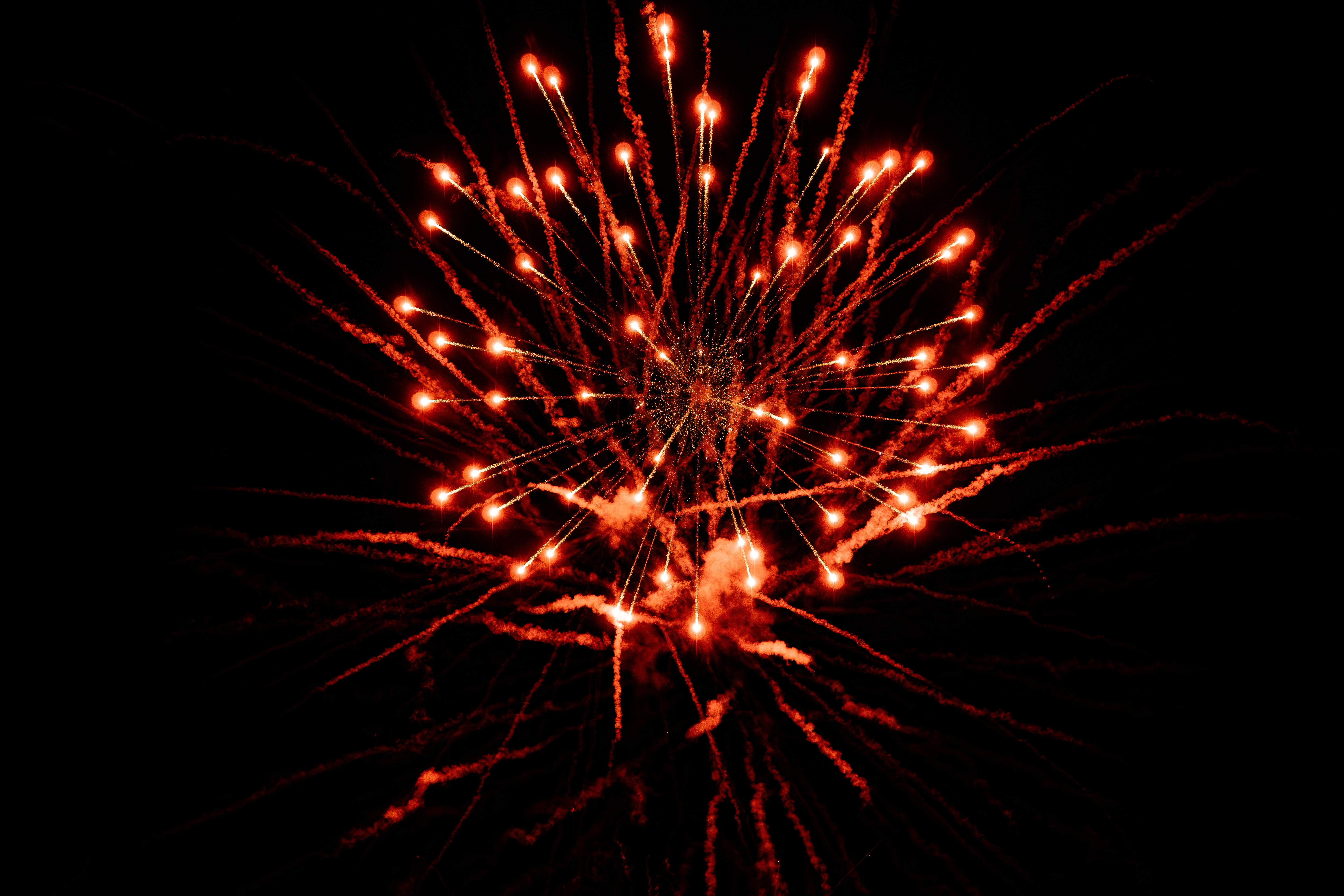 Vibrant Red Fireworks Display at Night · Free Stock Photo