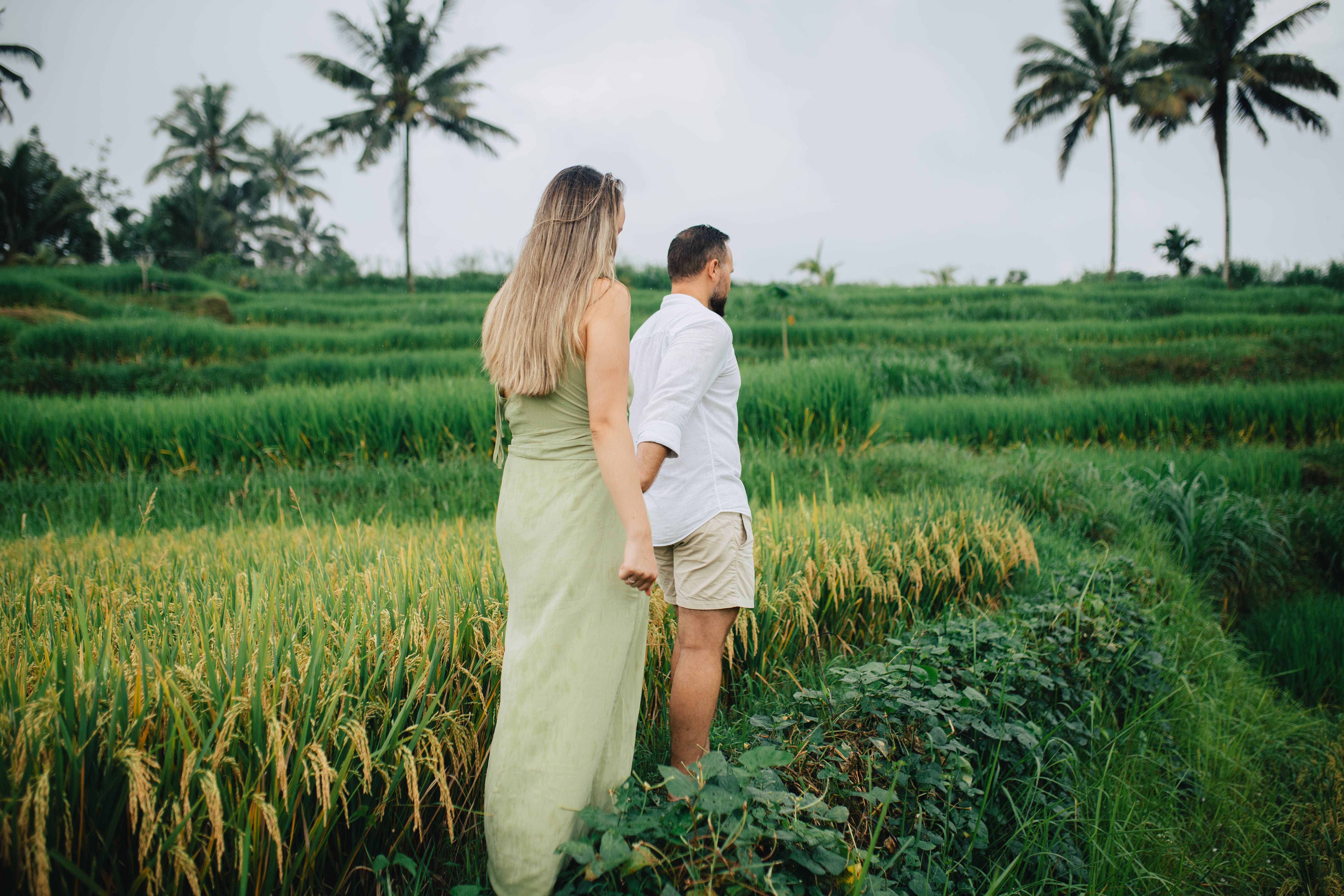 Couple Exploring Rice Terraces in Bali · Free Stock Photo