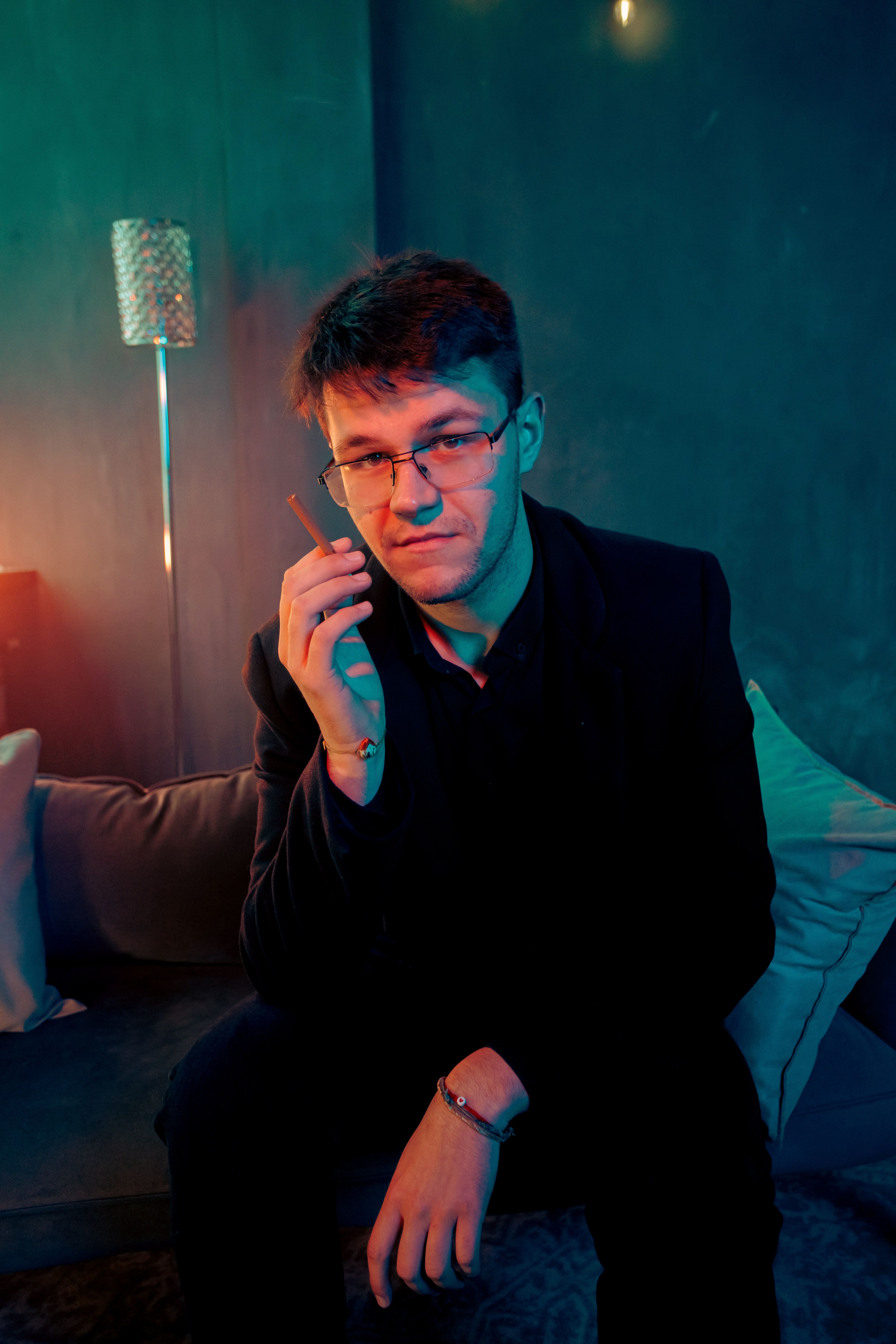 Moody Portrait of a Man in Dimly Lit Room · Free Stock Photo