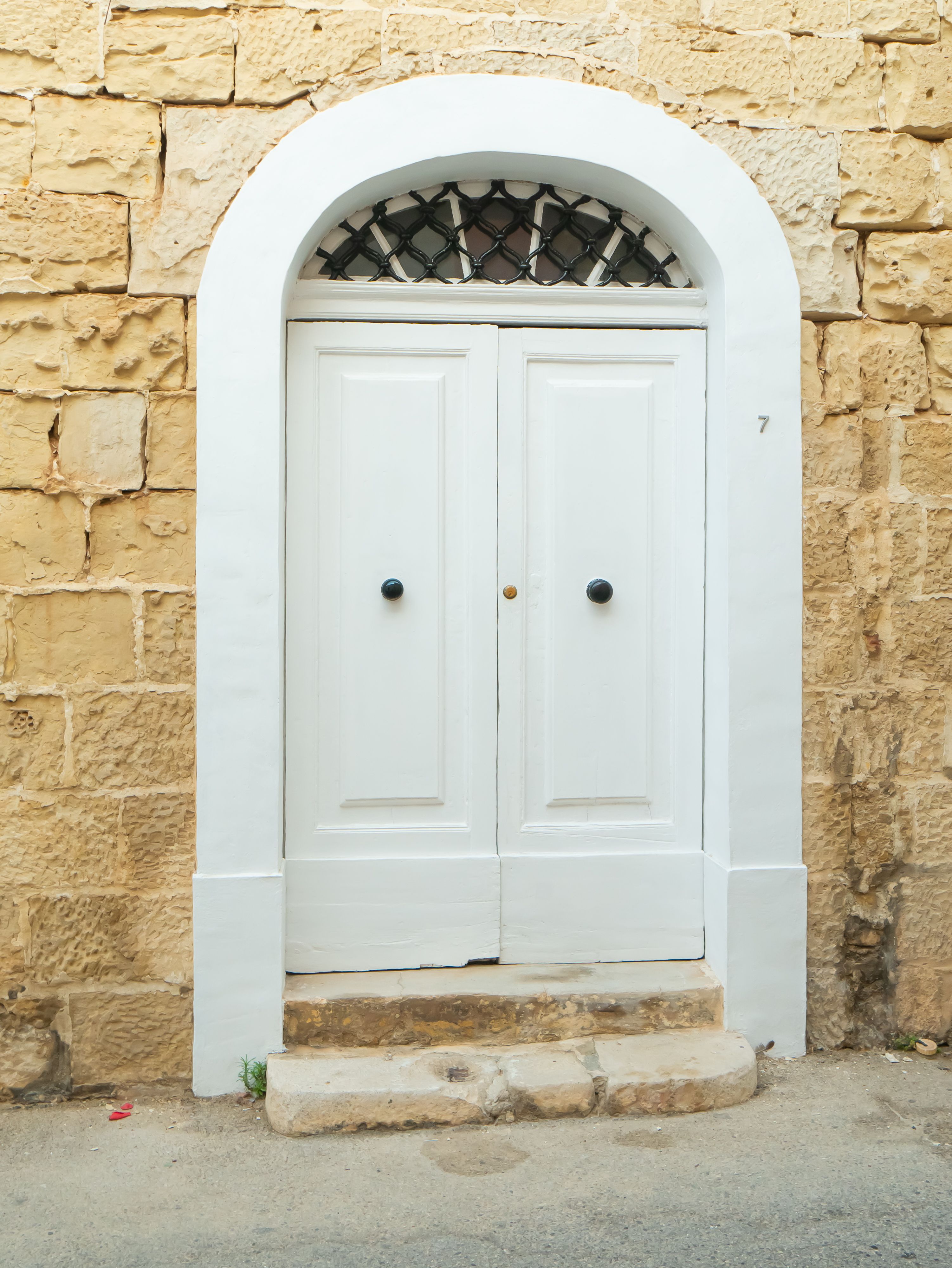 Elegant White Doorway with Stone Facade · Free Stock Photo