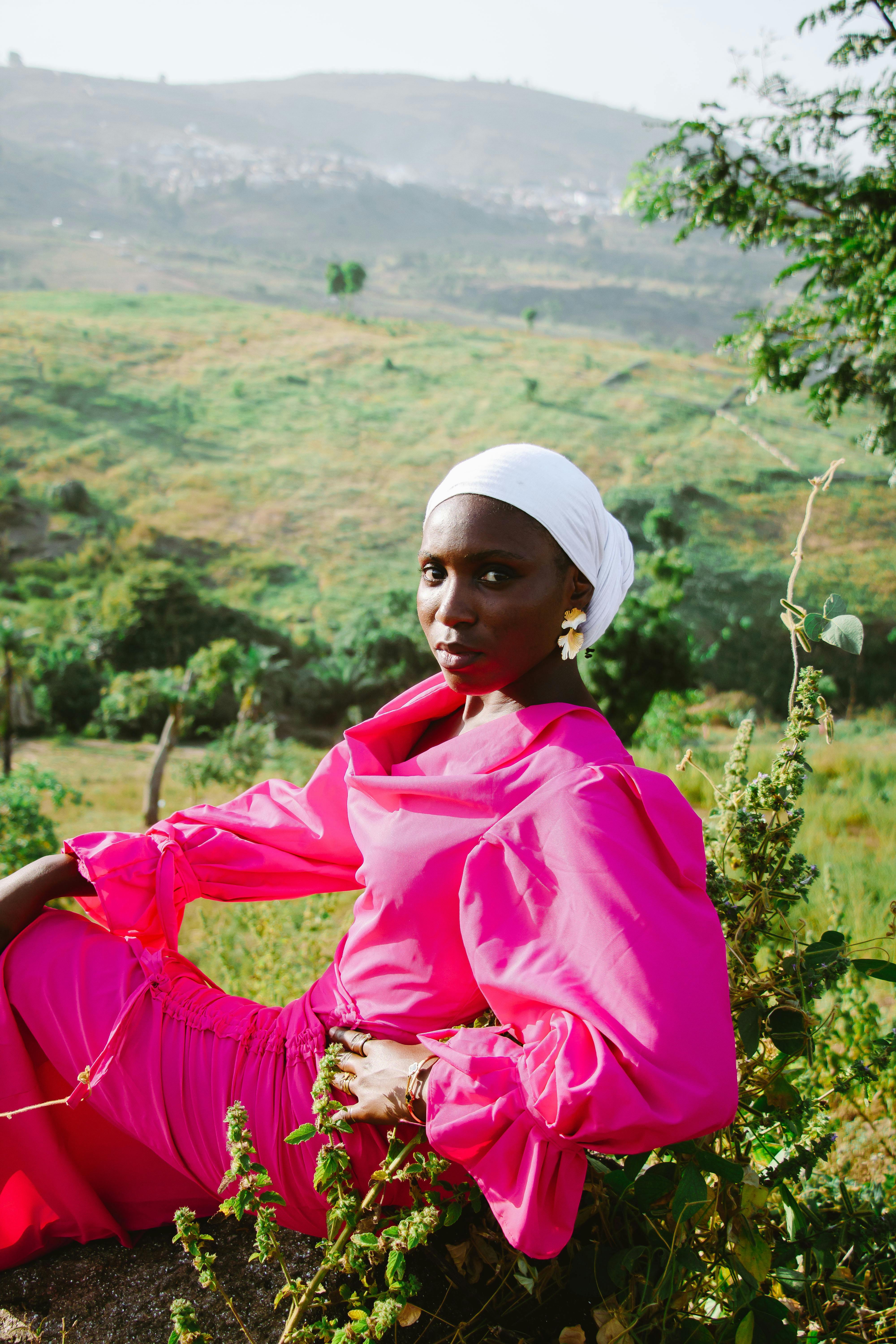 Elegant Woman in Bright Pink Dress Outdoors · Free Stock Photo