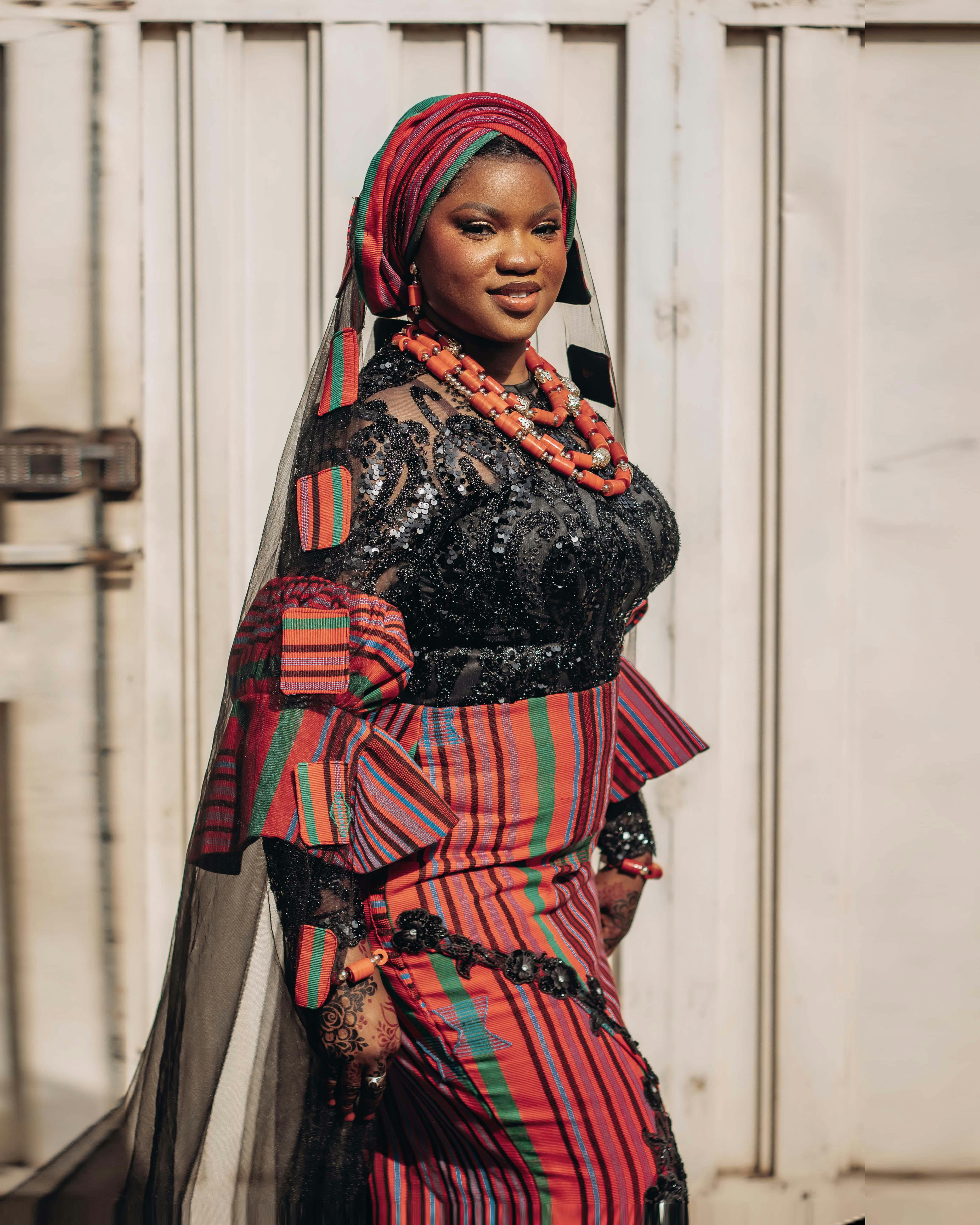 Elegant Traditional African Attire with Beaded Jewelry · Free Stock Photo