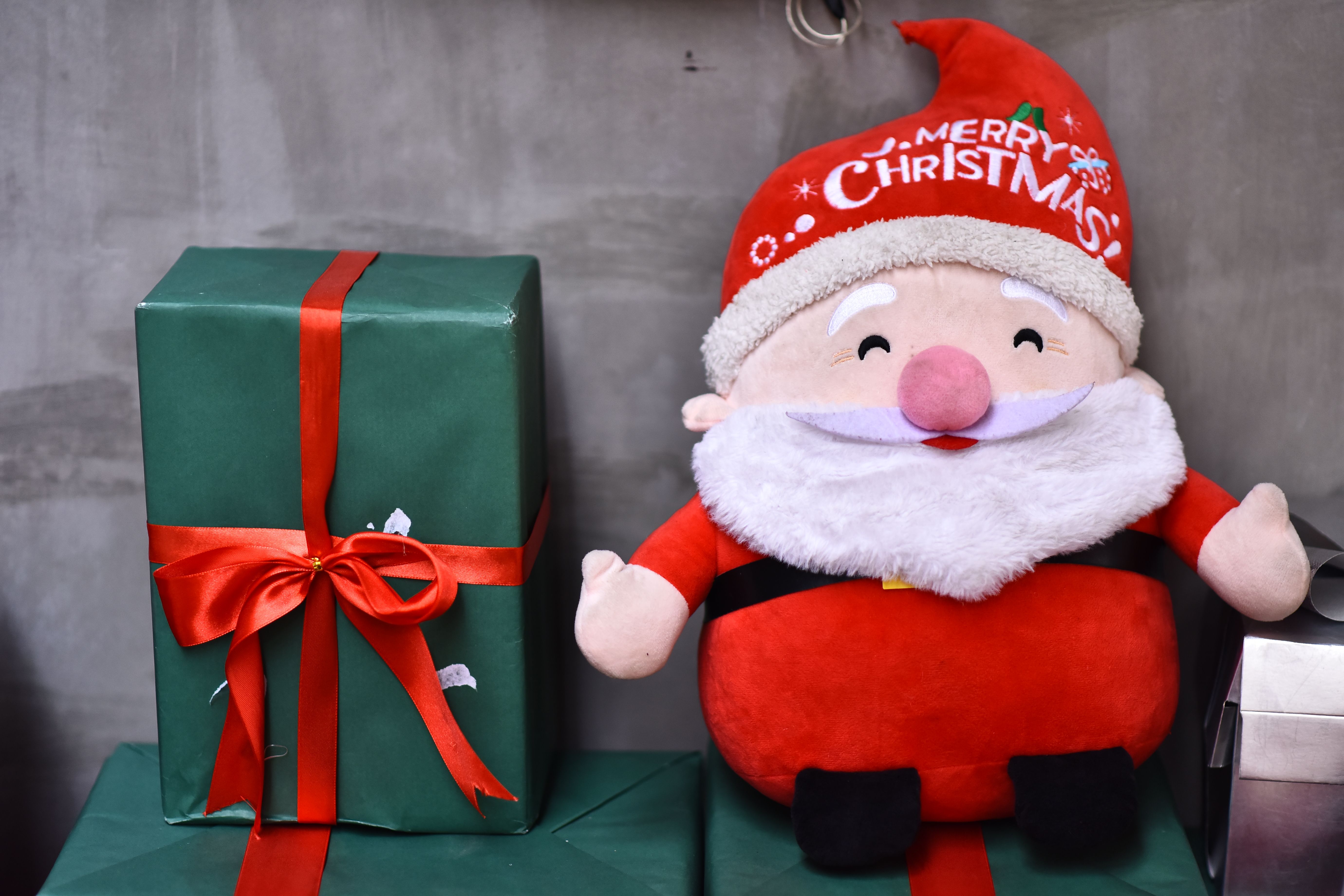 Festive Santa Plush Toy with Christmas Gift Box · Free Stock Photo