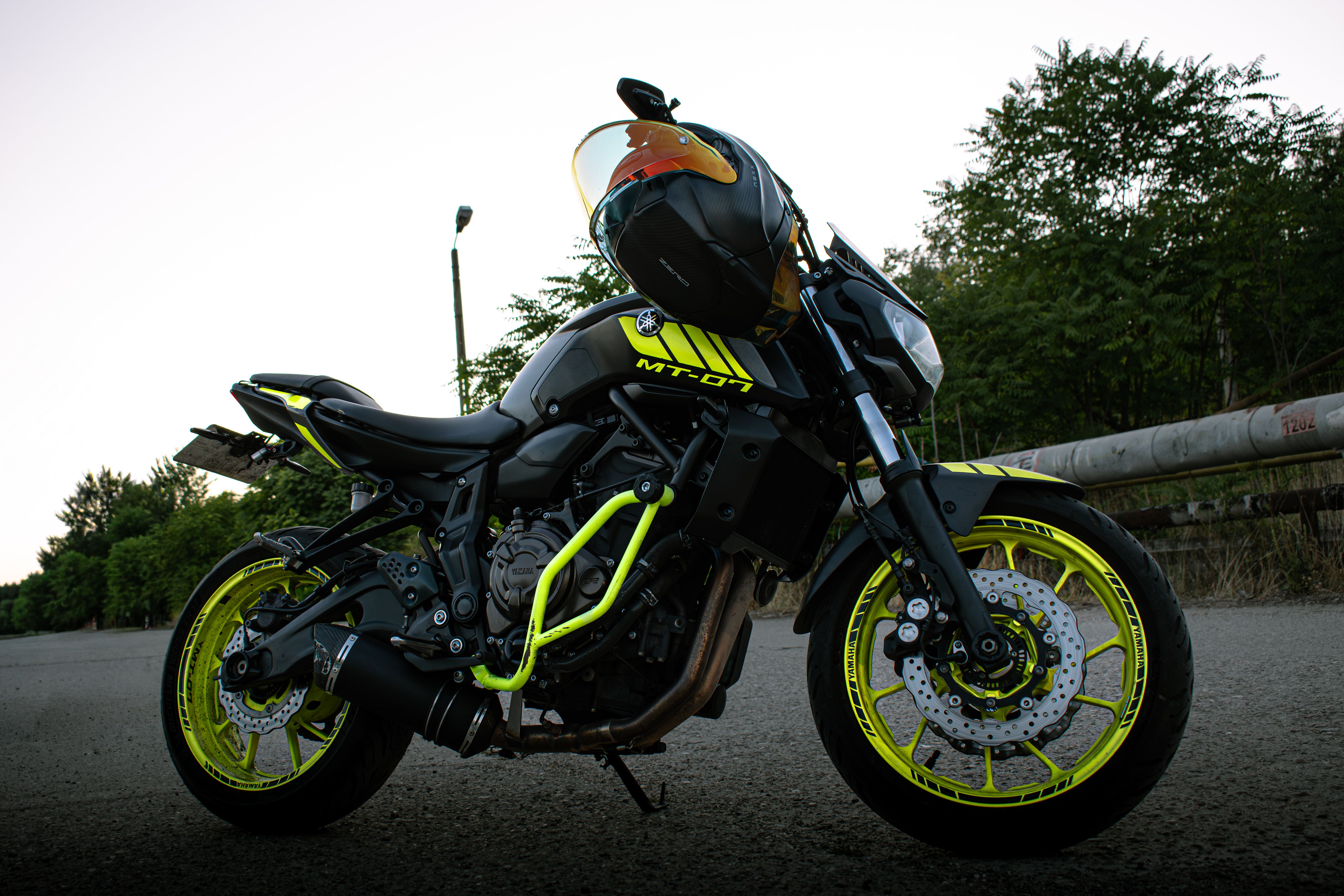 Dynamic street motorcycle with helmet outdoors · Free Stock Photo