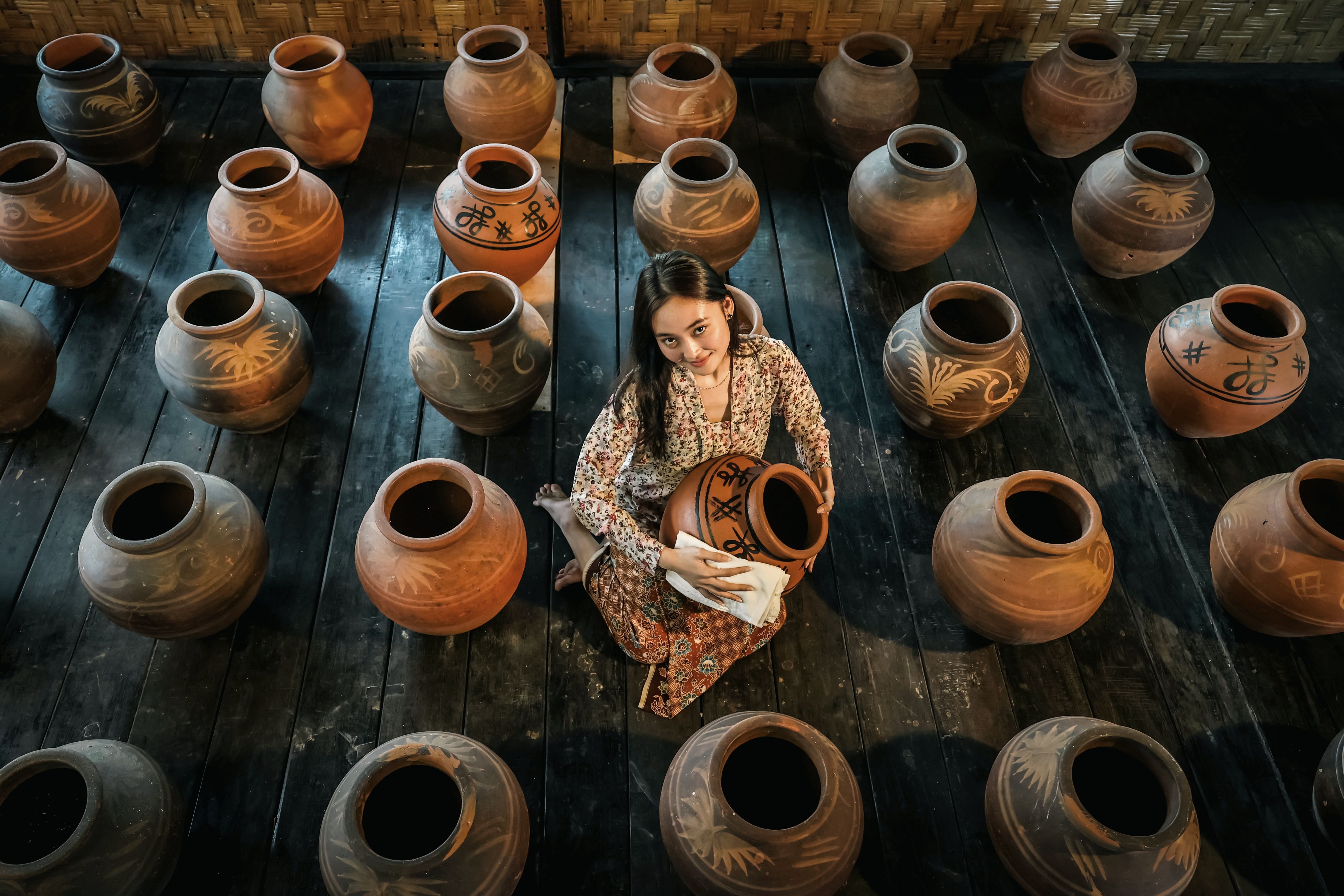 Javanese Potter Surrounded by Clay Pots in Indonesia · Free Stock Photo