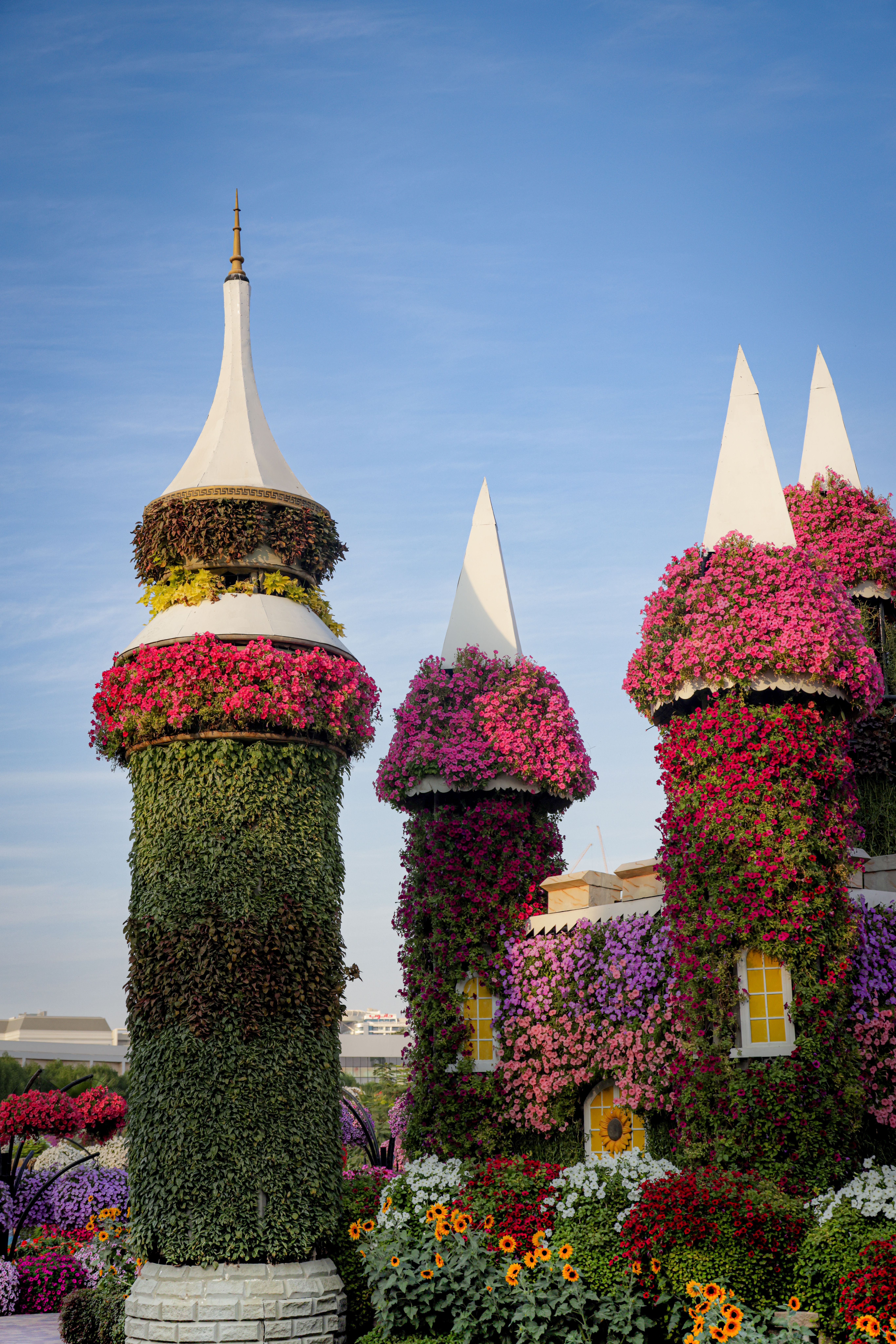 Floral Castle Towers in Vibrant Garden Setting · Free Stock Photo