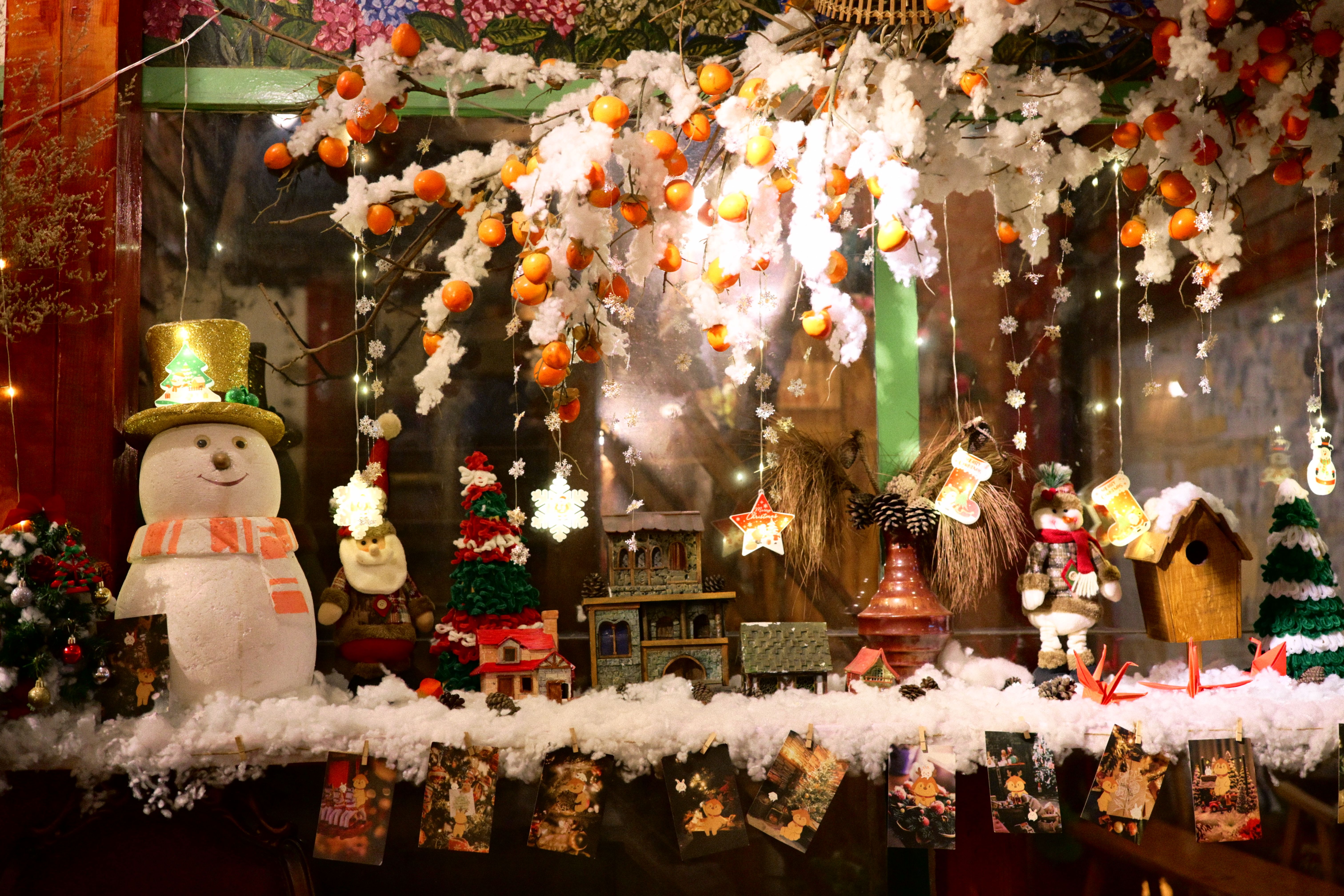 Festive Holiday Window Display with Snowman and Ornaments · Free Stock ...