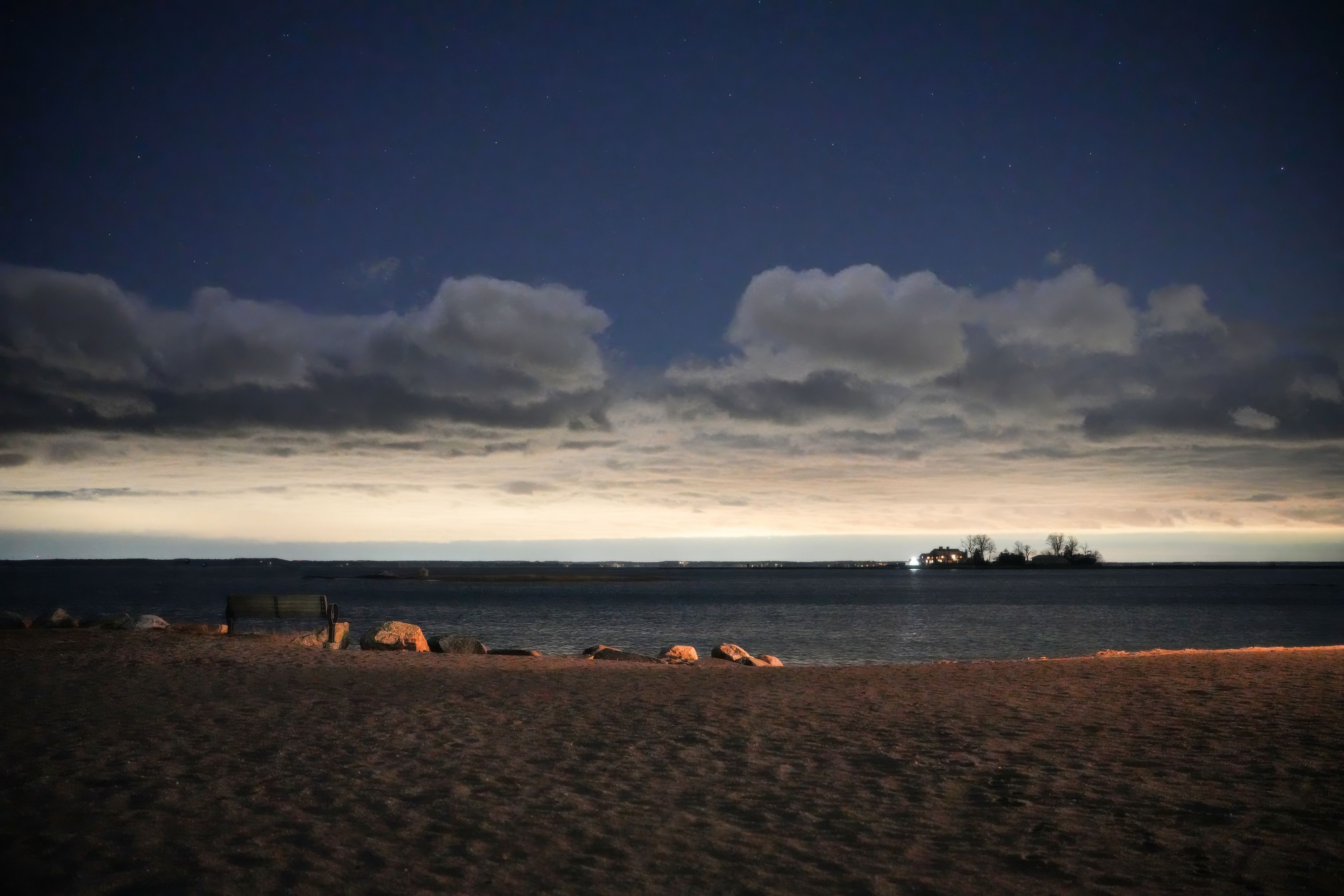 Tranquil Night Beach Scene with Cloudy Sky · Free Stock Photo