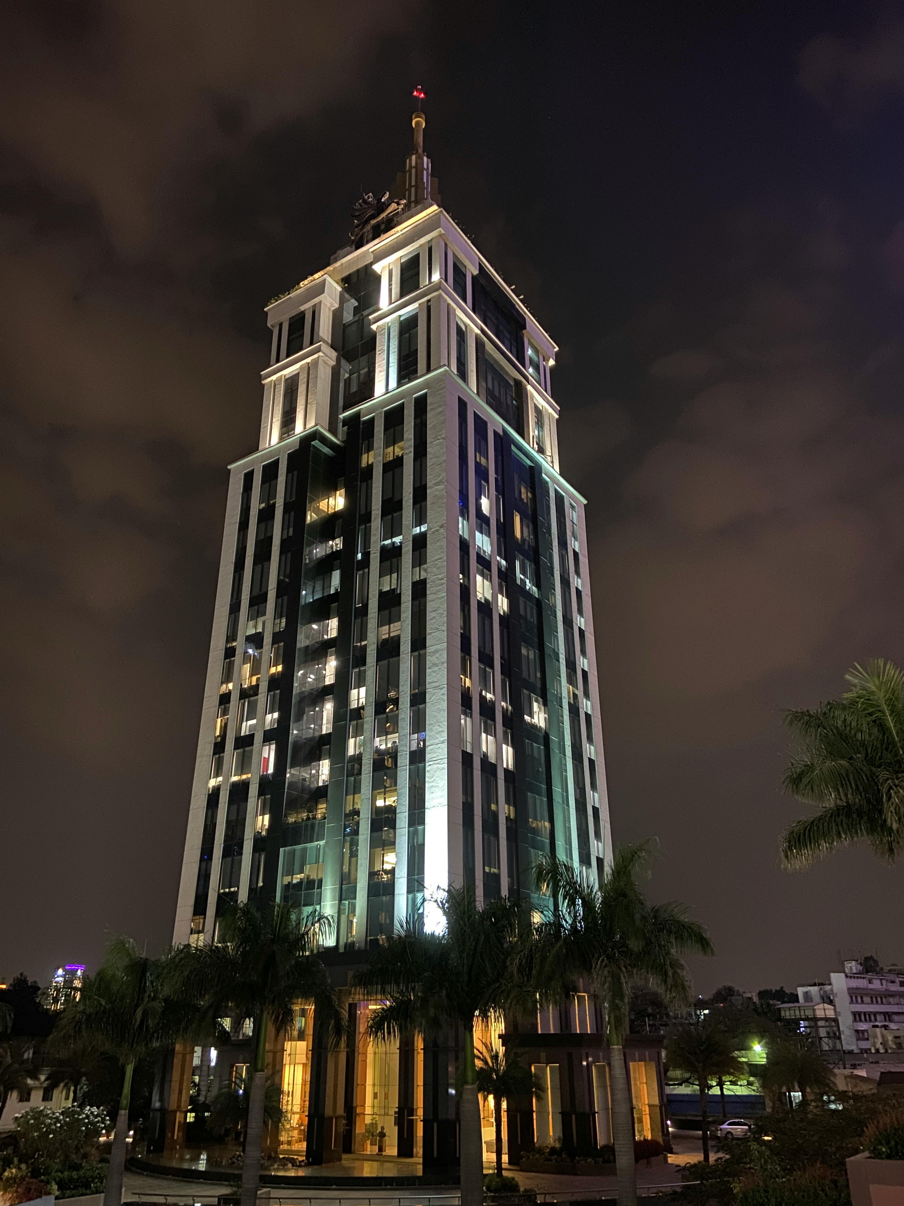 Iconic Bengaluru Building at Night with Illuminated Cityscape · Free Stock Photo