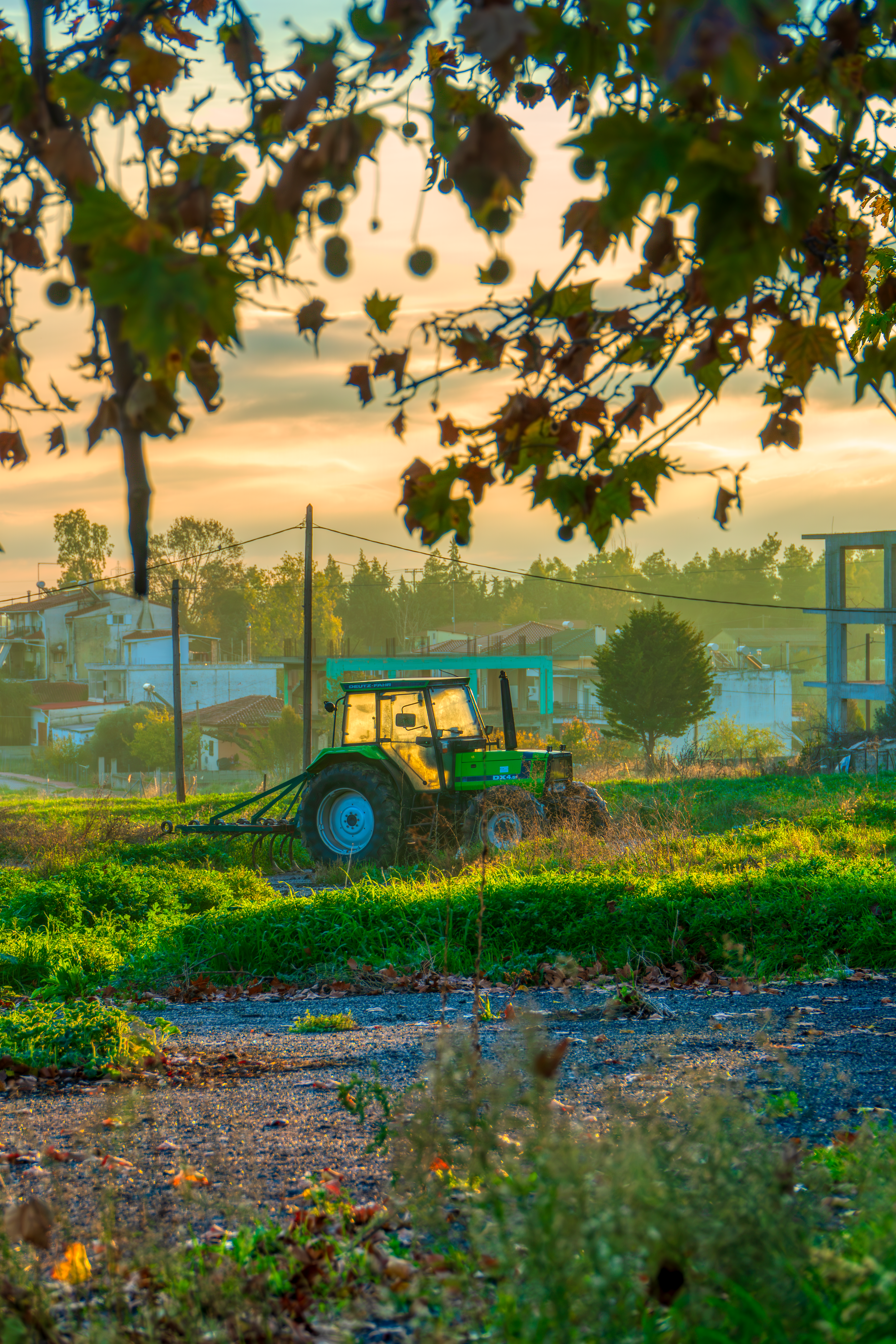 Sunset Over a Greek Countryside with Tractor · Free Stock Photo