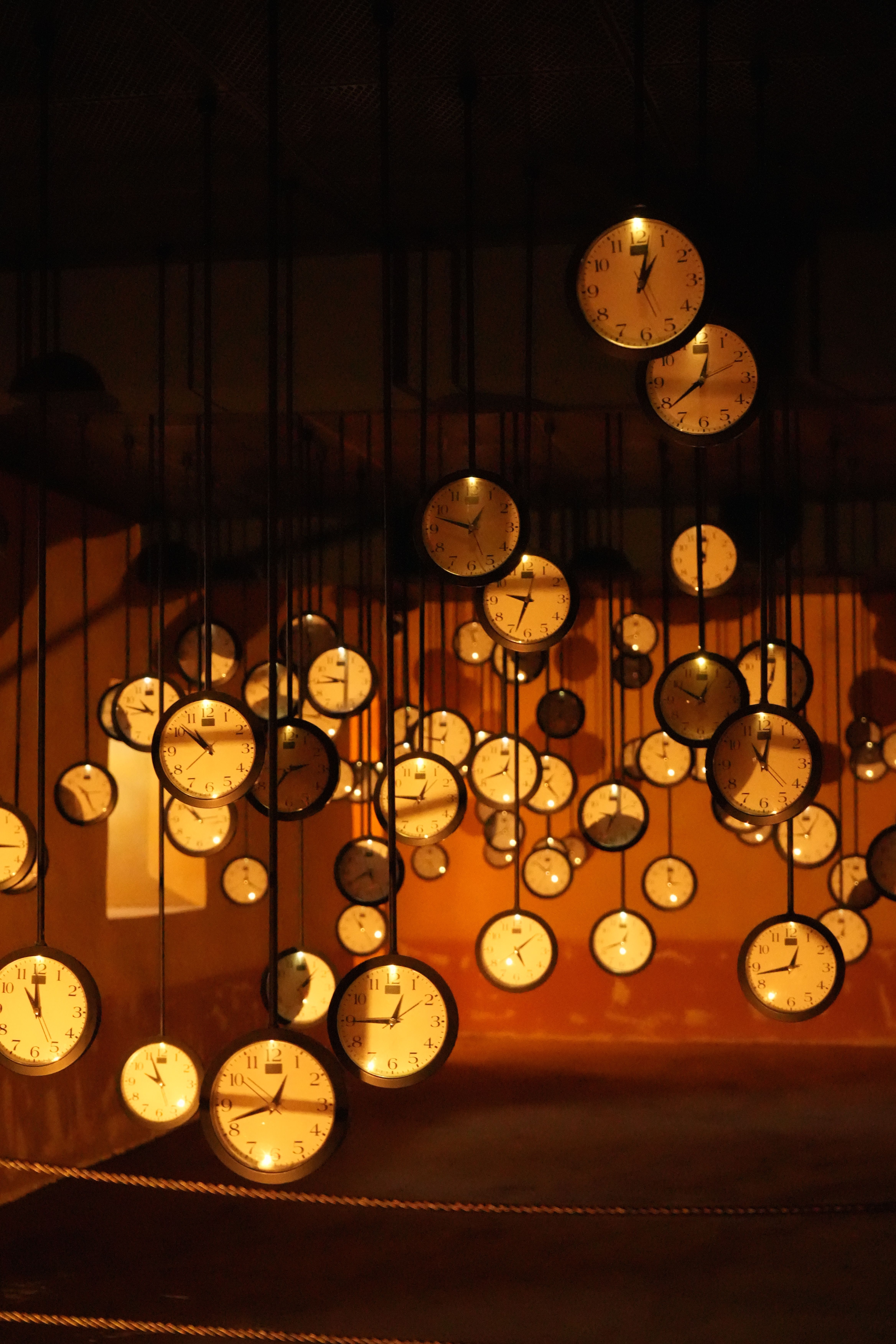 Surreal Installation of Hanging Clocks · Free Stock Photo