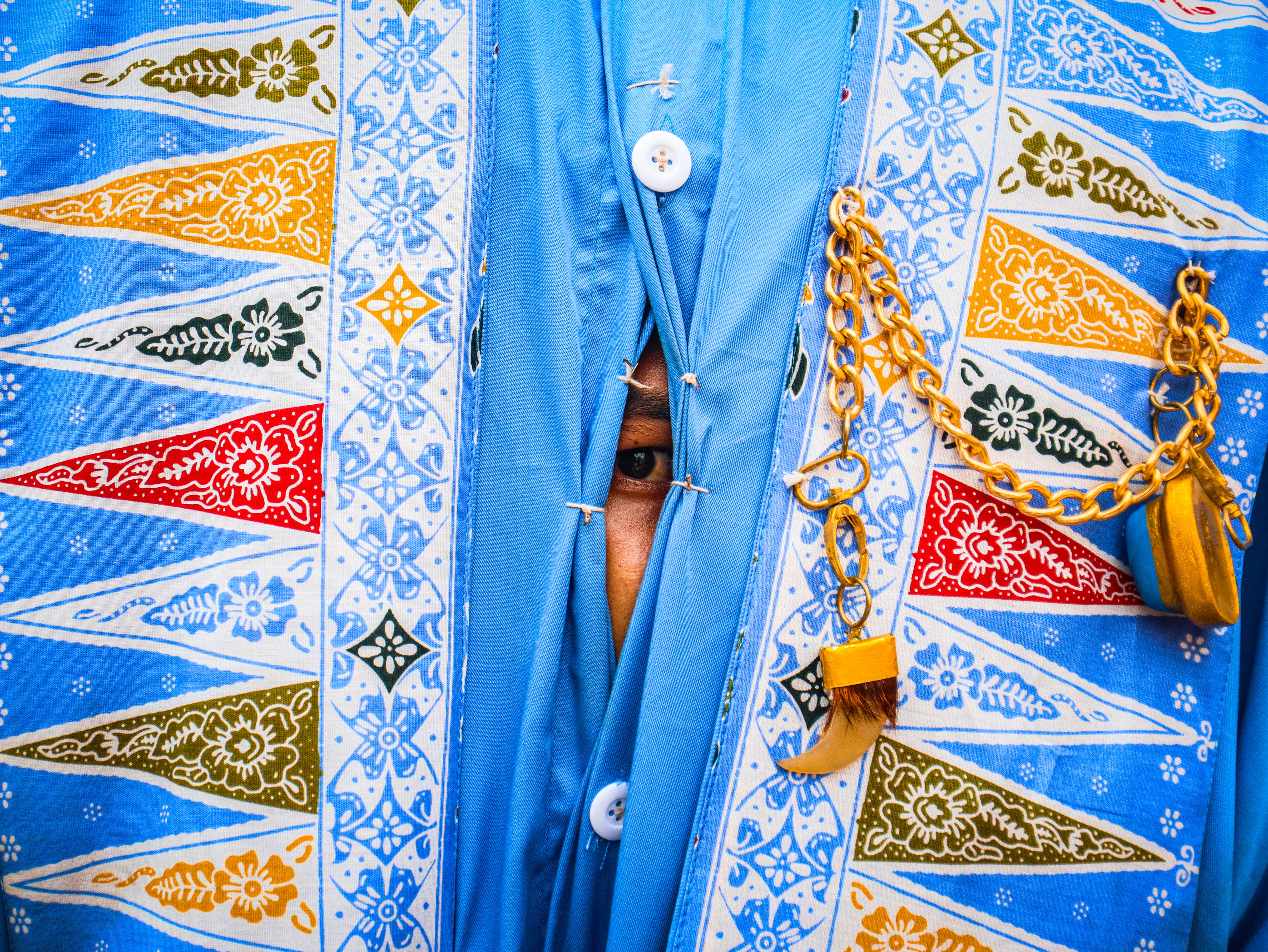 Colorful Batik Fabric with Eye Peeking Through · Free Stock Photo