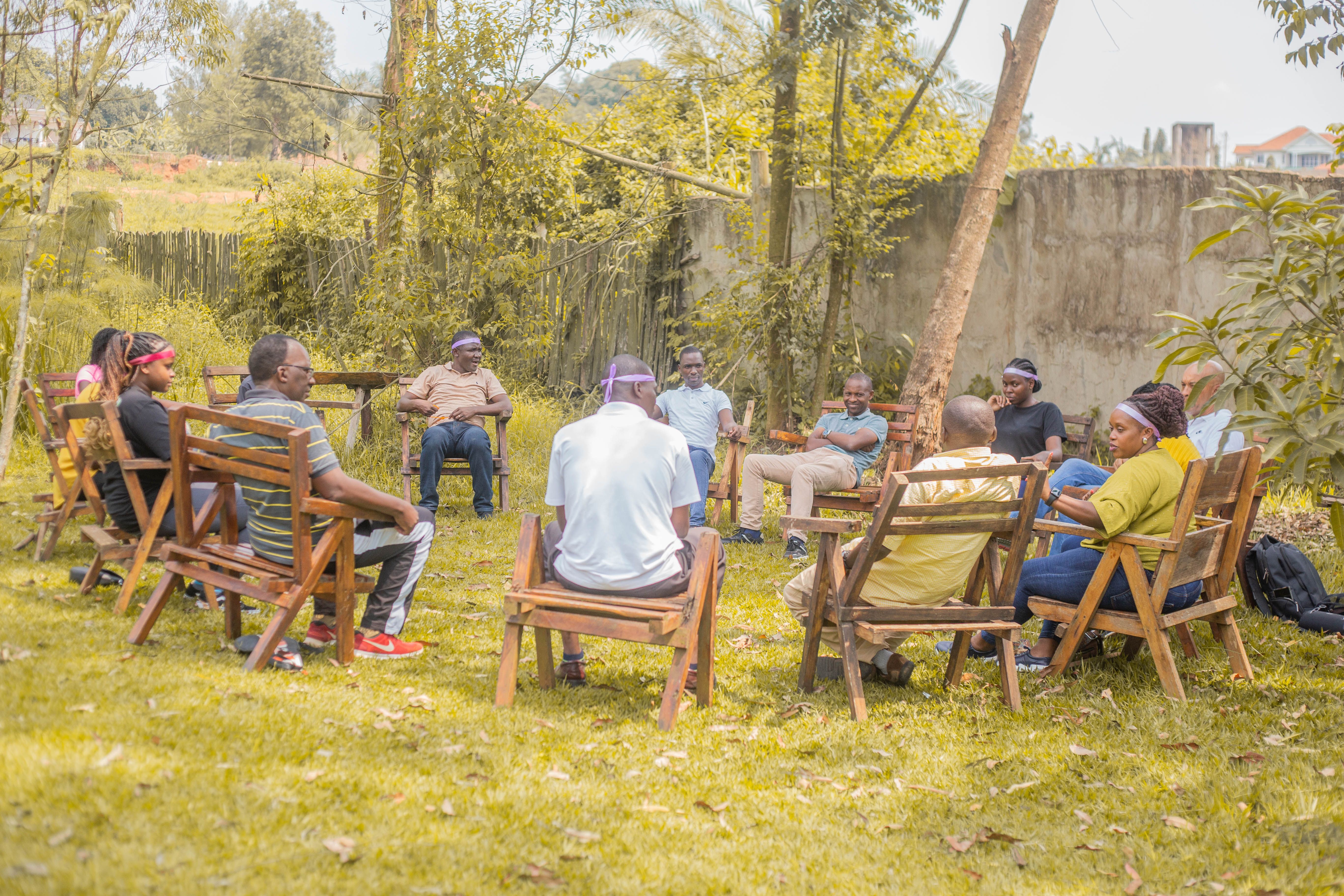 Outdoor Group Meeting in a Tranquil Garden Setting · Free Stock Photo