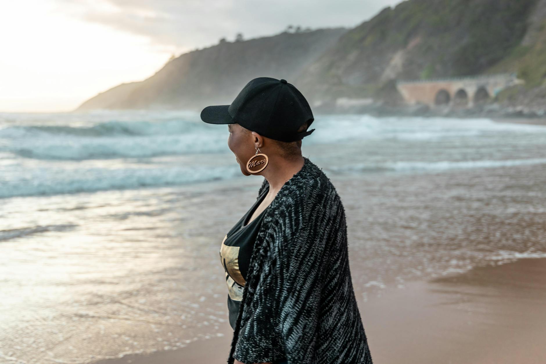 Unrecognizable Black Woman Contemplating Wavy Sea On Shore · Free Stock