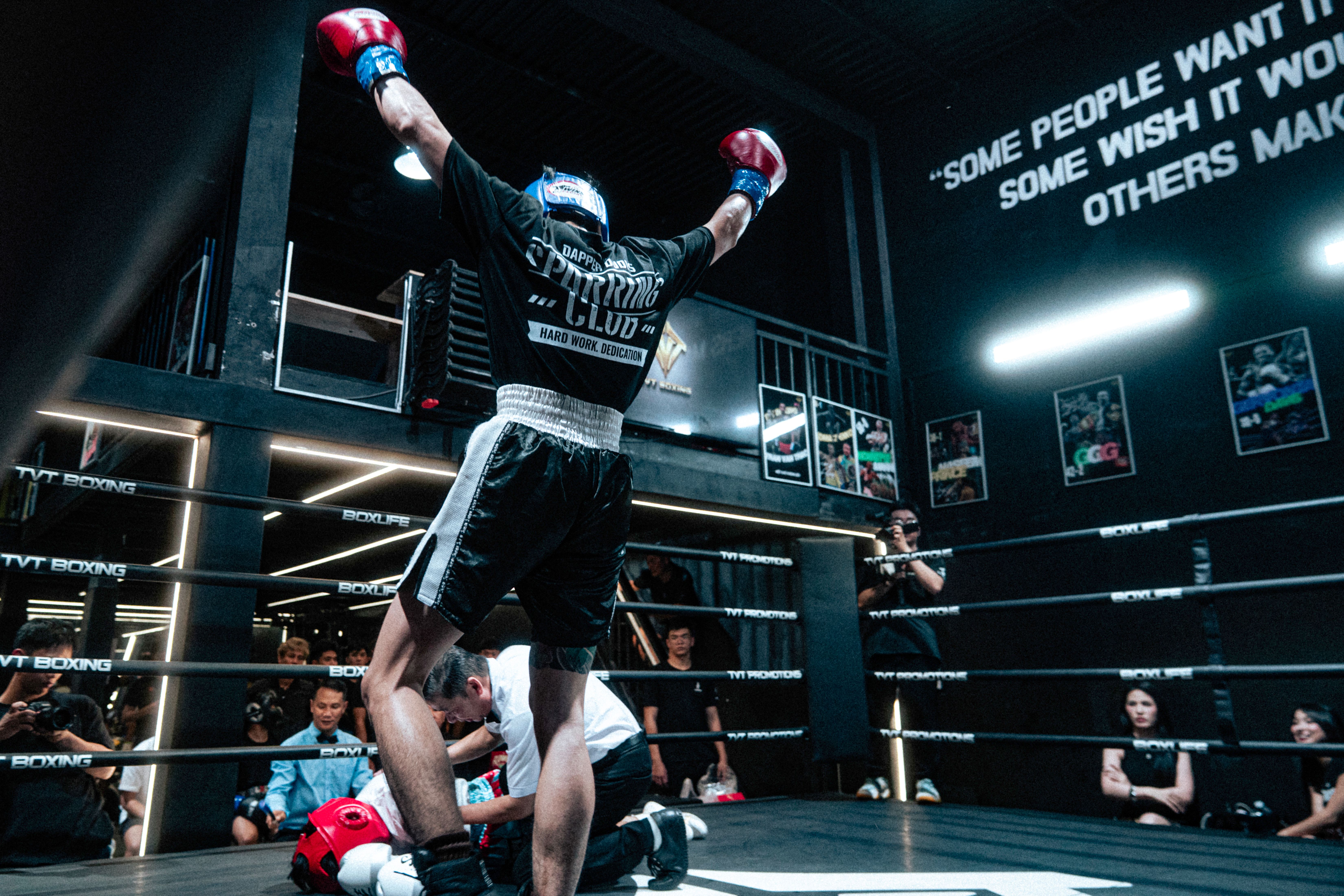 Triumphant Boxer Celebrating in Ring Victory · Free Stock Photo