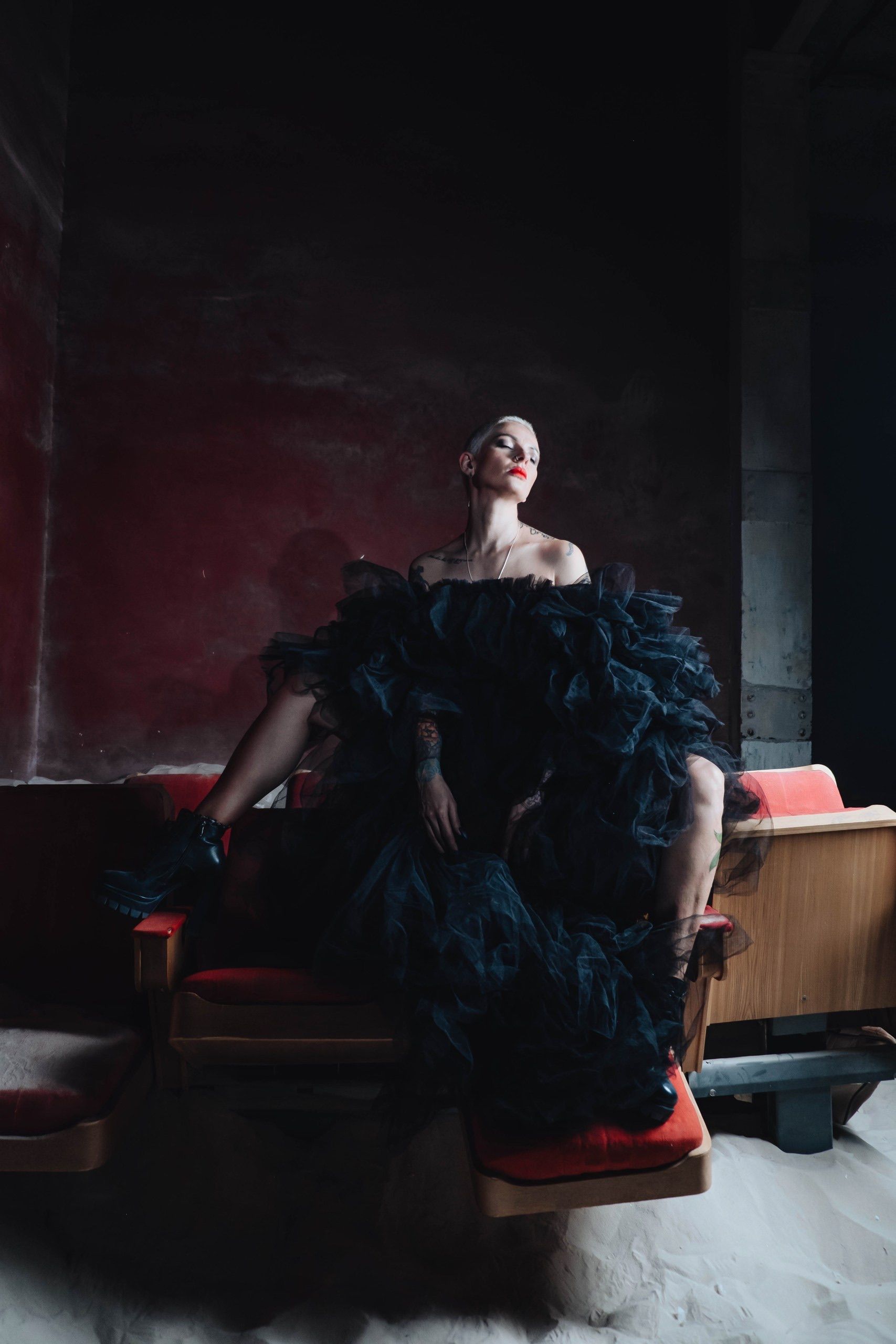 Dramatic Fashion Portrait in Dark Interior · Free Stock Photo
