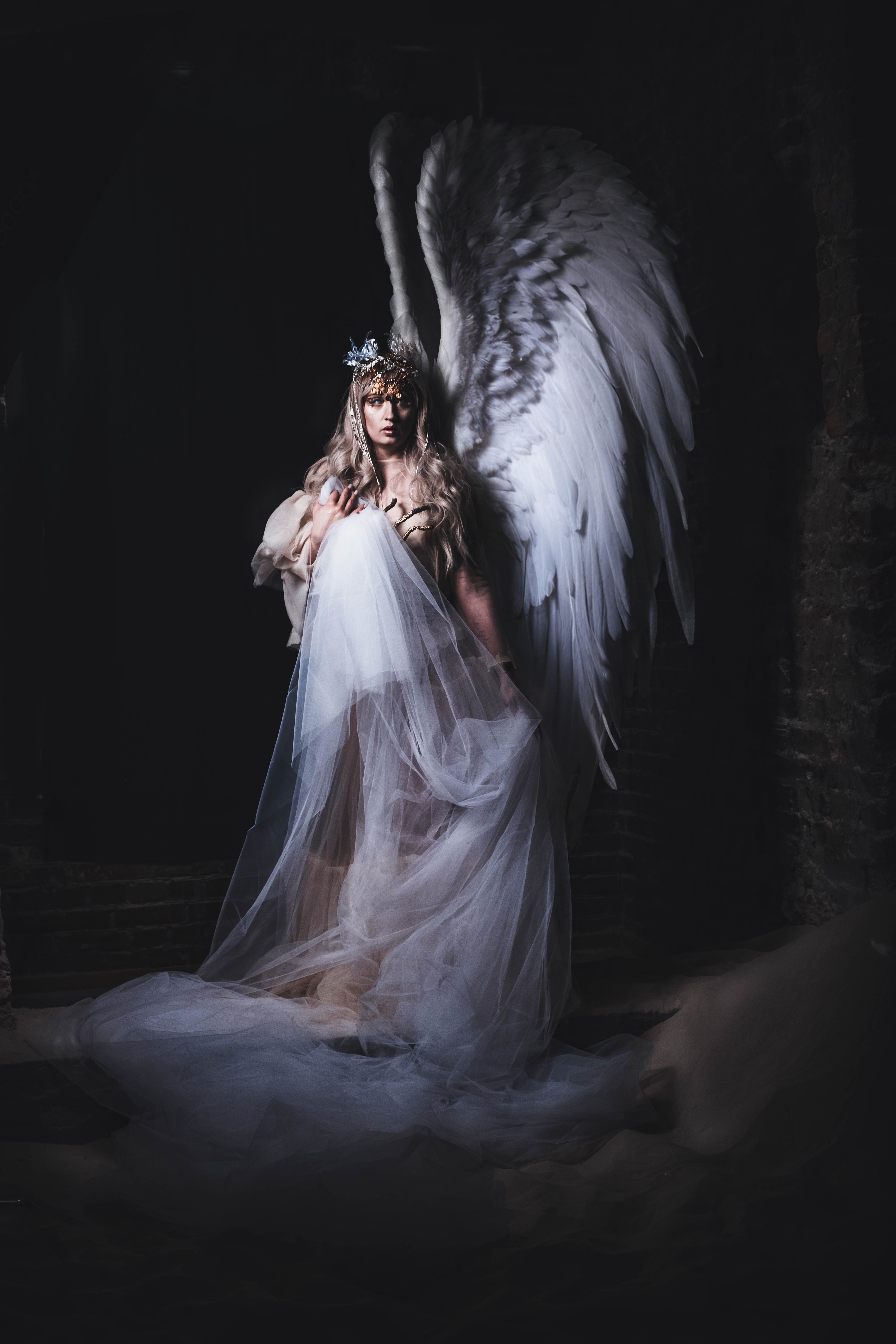 Ethereal Angel with Flowing Gown and Wings · Free Stock Photo
