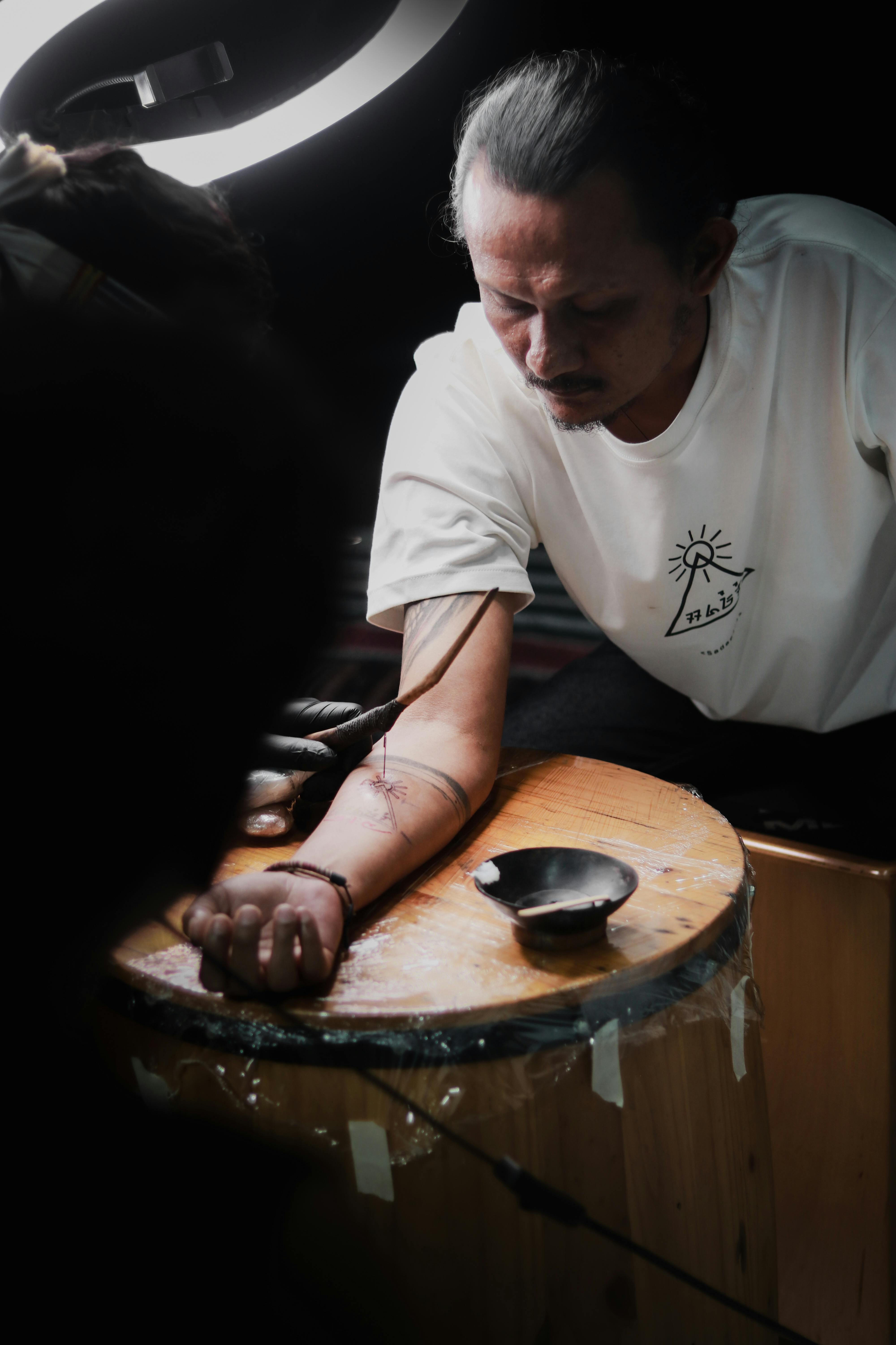 Man Receiving Traditional Tattoo in West Java · Free Stock Photo