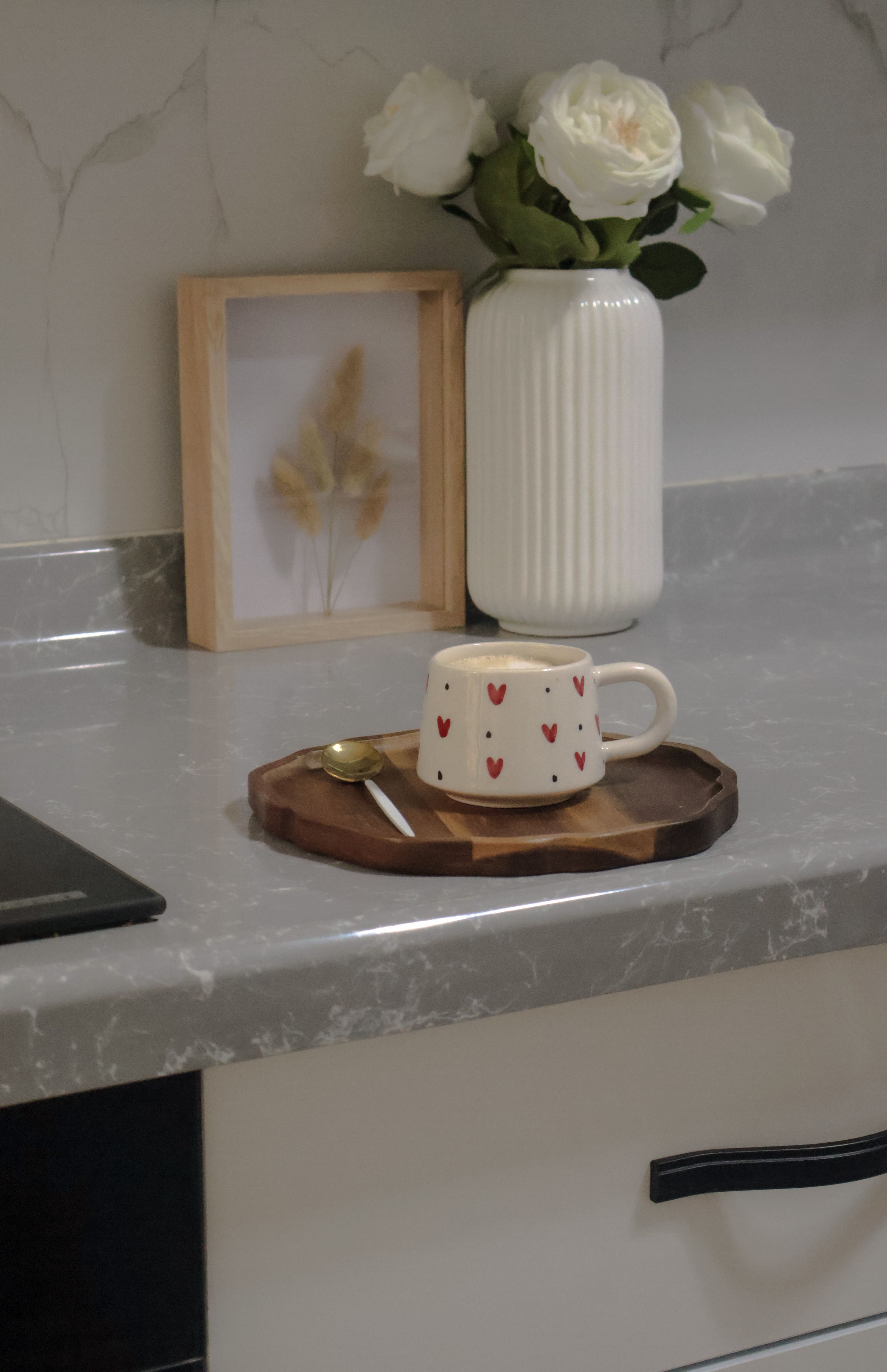 Cozy Kitchen Counter with Coffee Mug and Flowers · Free Stock Photo