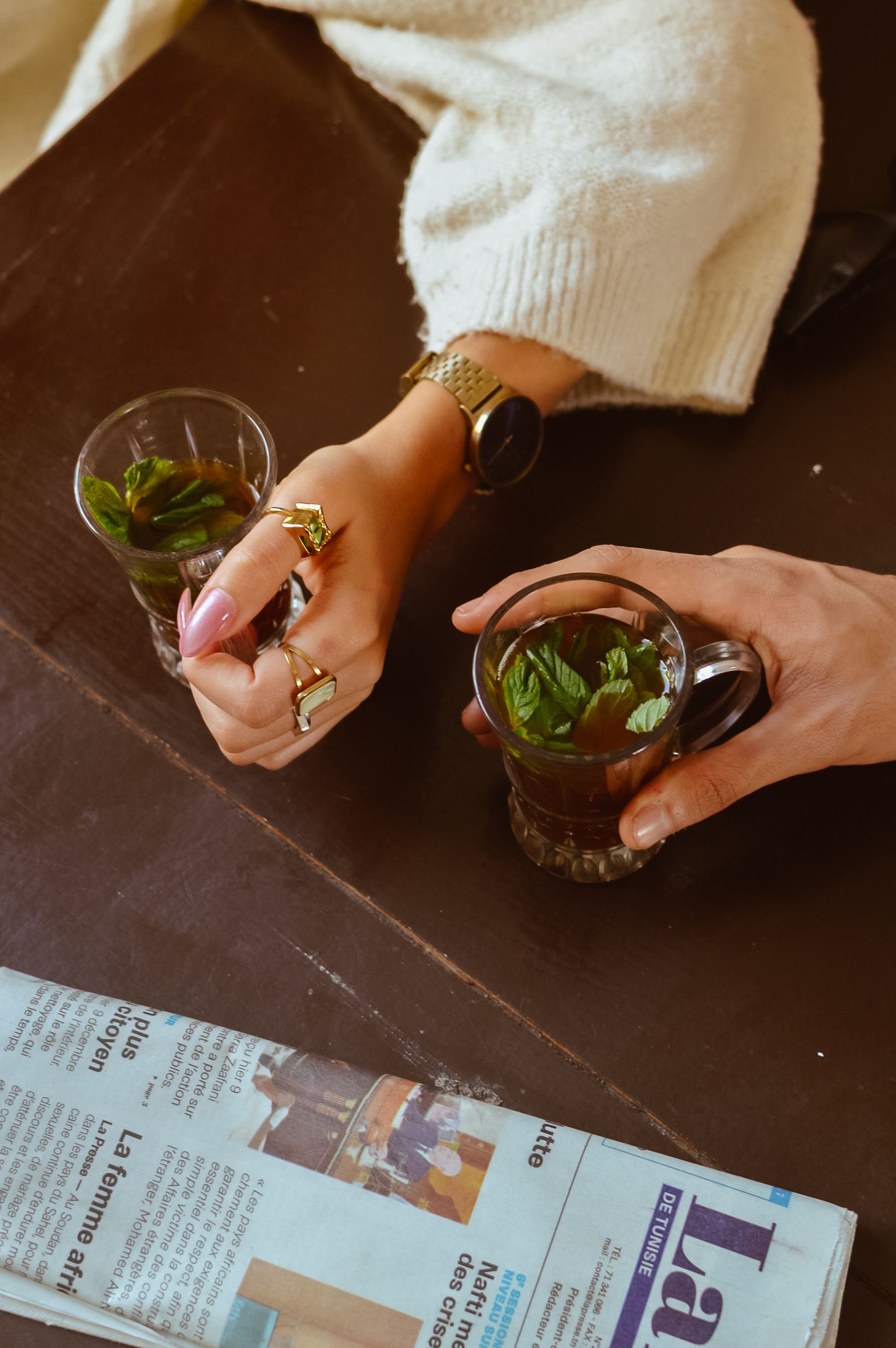 Cozy Tea Time with Mint Infusion and Newspaper · Free Stock Photo