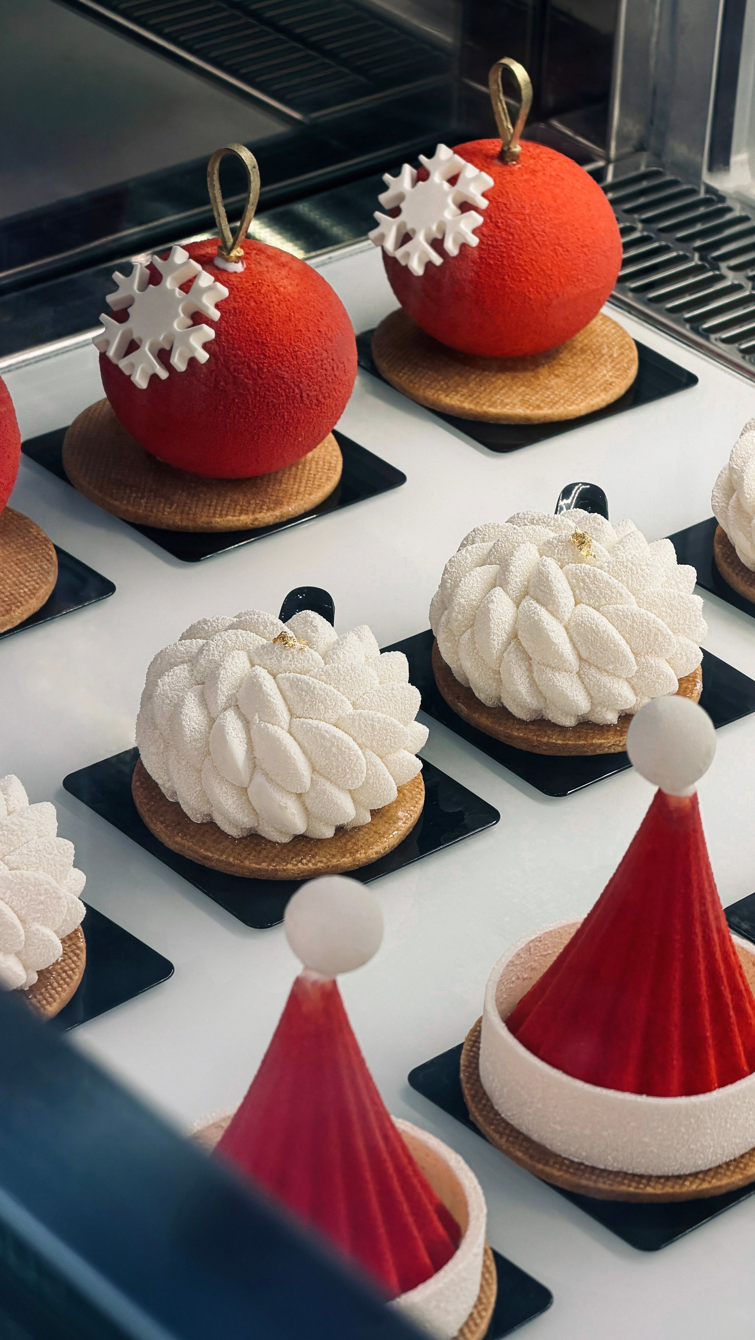 Decorative Christmas Pastries in Display Case · Free Stock Photo