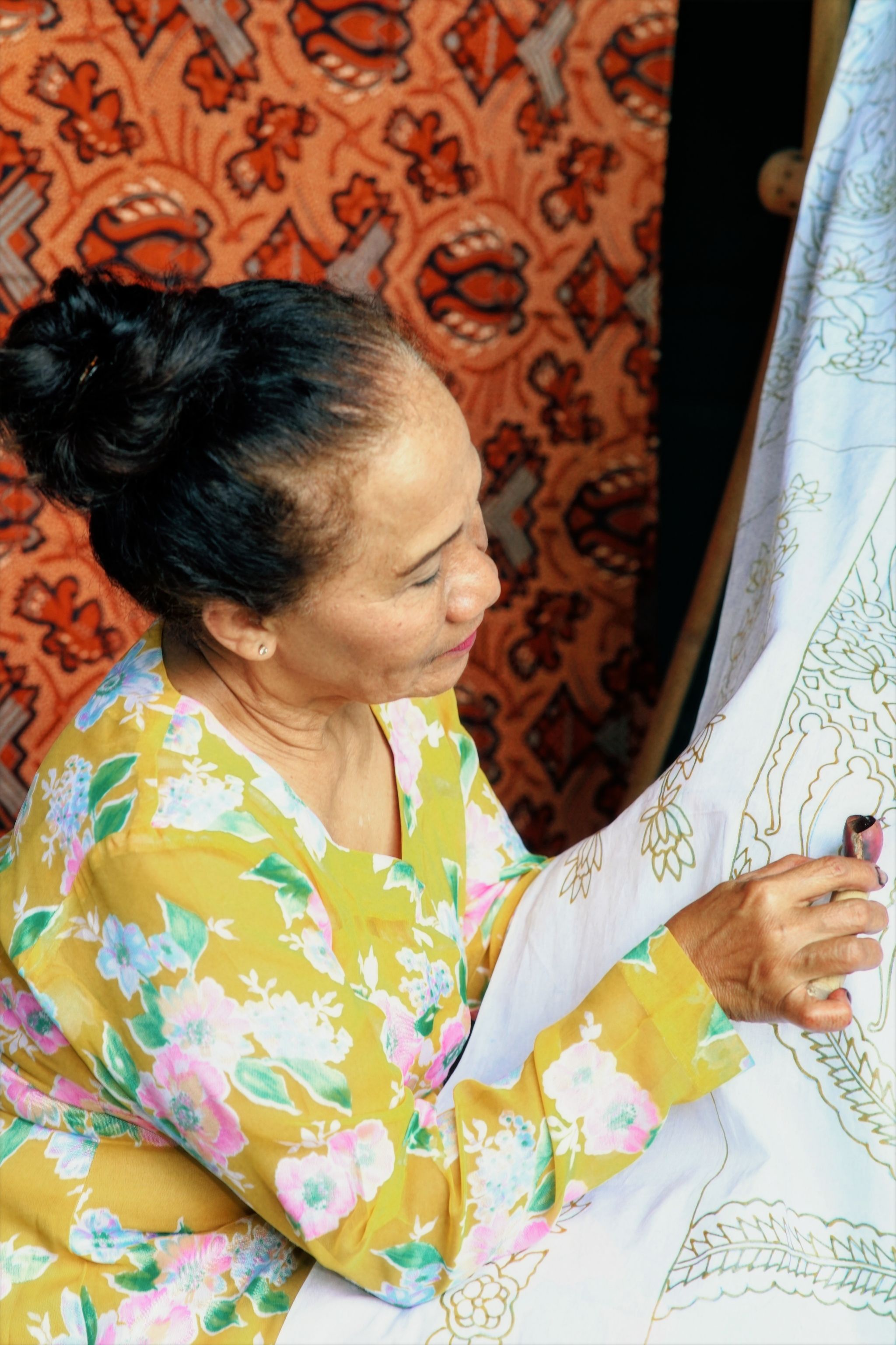 Artisan Crafting Intricate Batik Design in Indonesia · Free Stock Photo