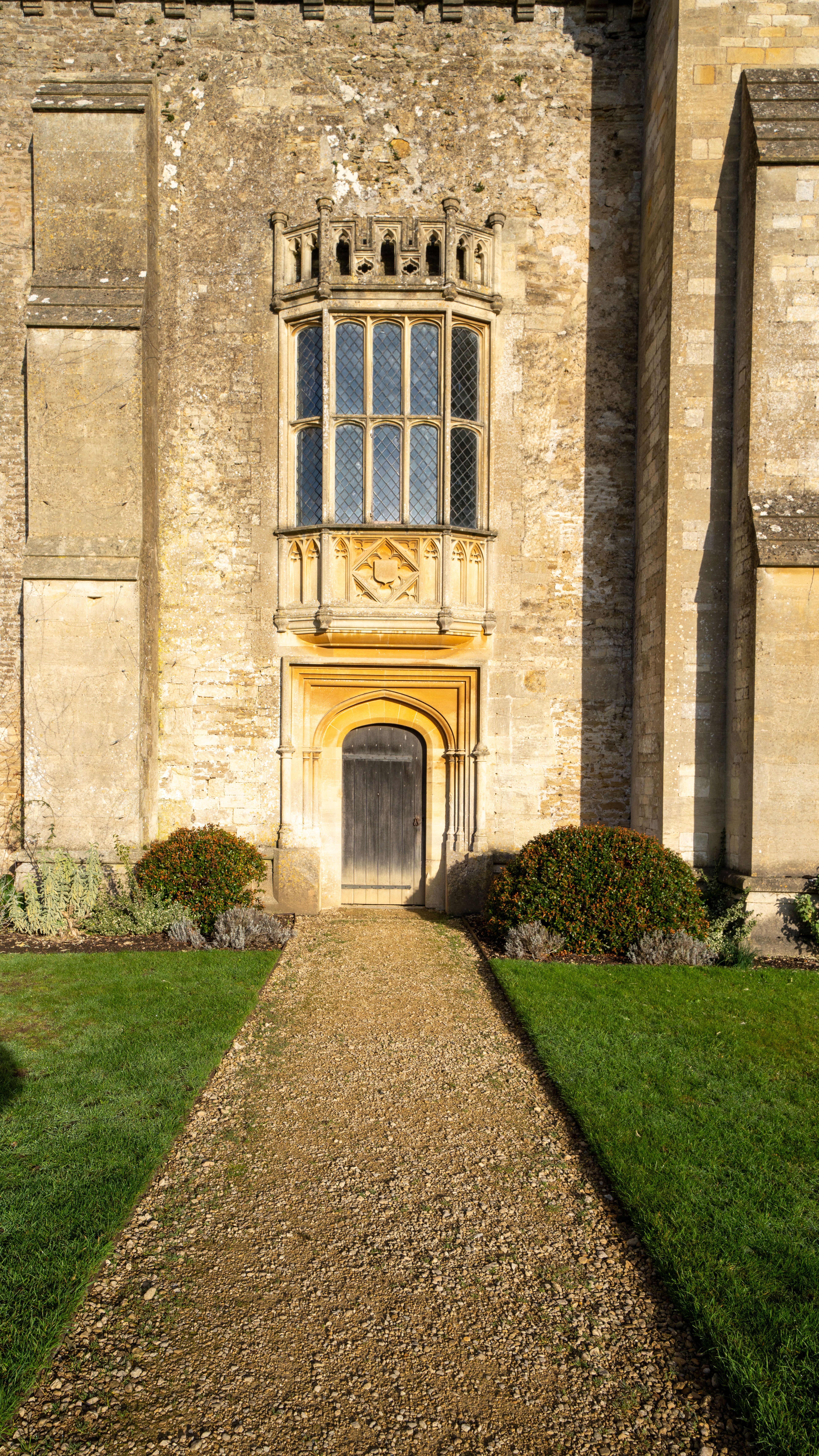 Historic Lacock Abbey Stone Facade in Sunlight · Free Stock Photo