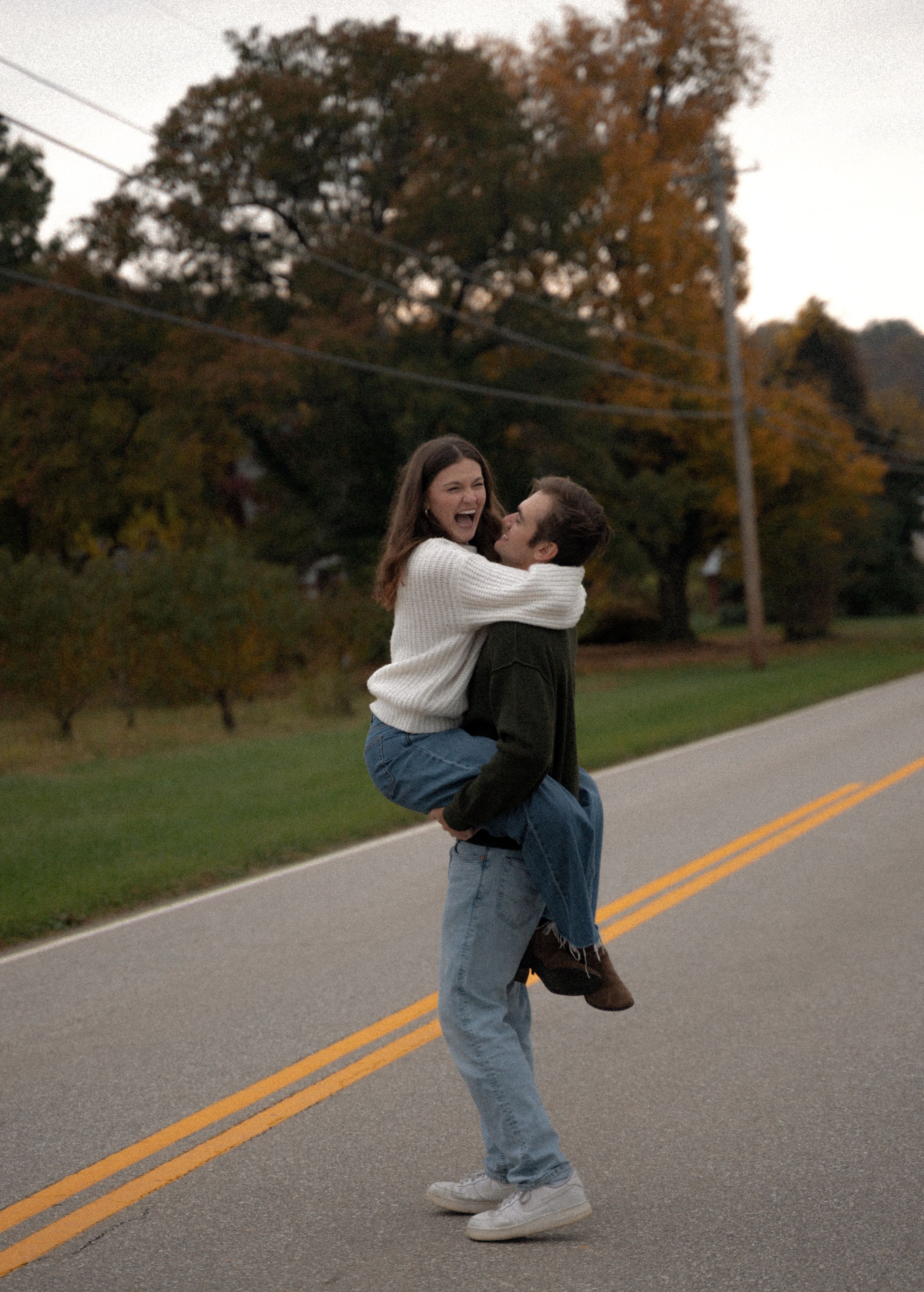 Romantic Fall Couple Embrace on Country Road · Free Stock Photo