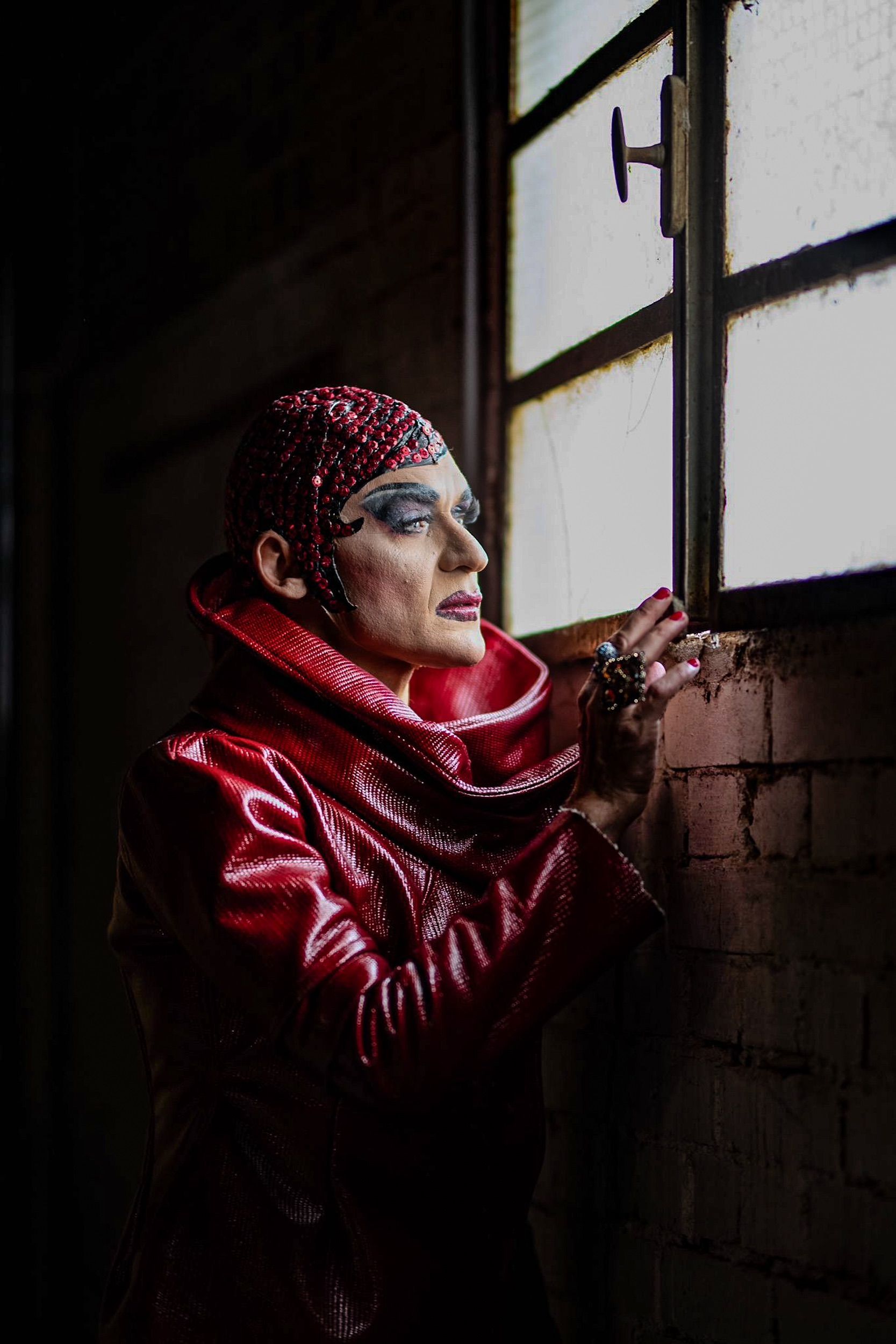Dramatic Portrait of a Performer in Red Costume · Free Stock Photo