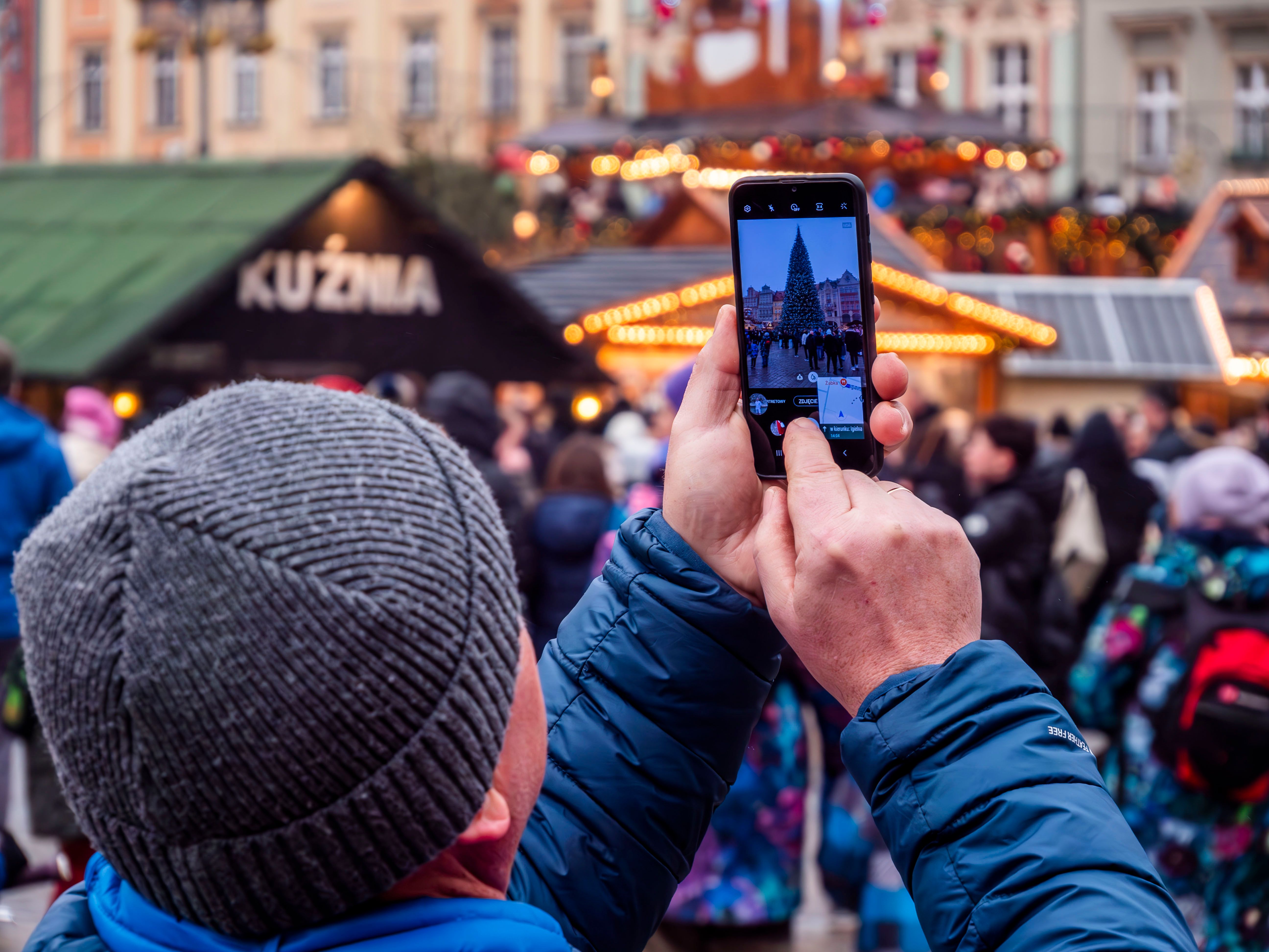 Tourist Scrolling Their Phone Photos, Download The BEST Free Tourist ...