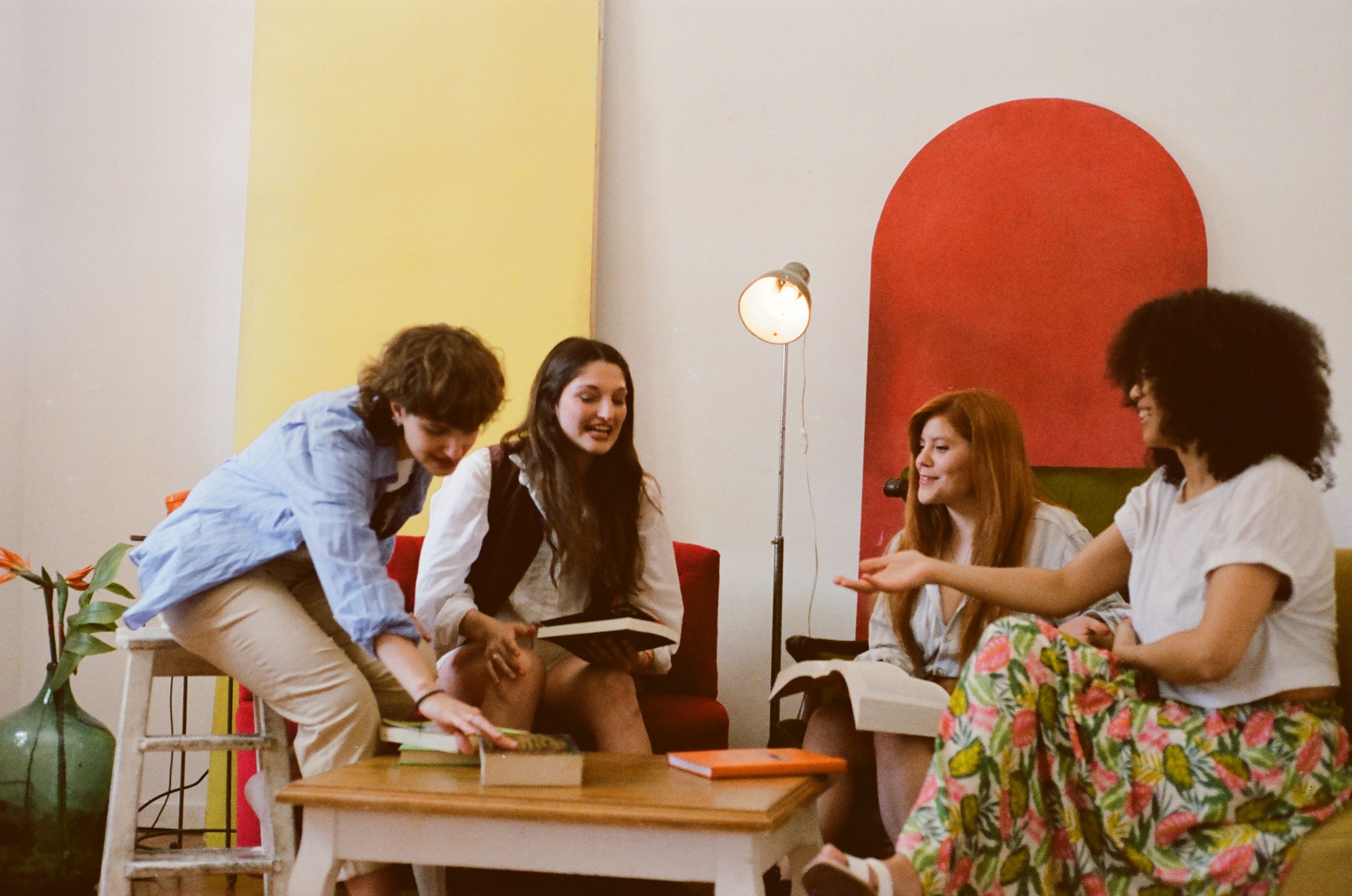 Group of Friends Enjoying a Cozy Indoor Gathering · Free Stock Photo
