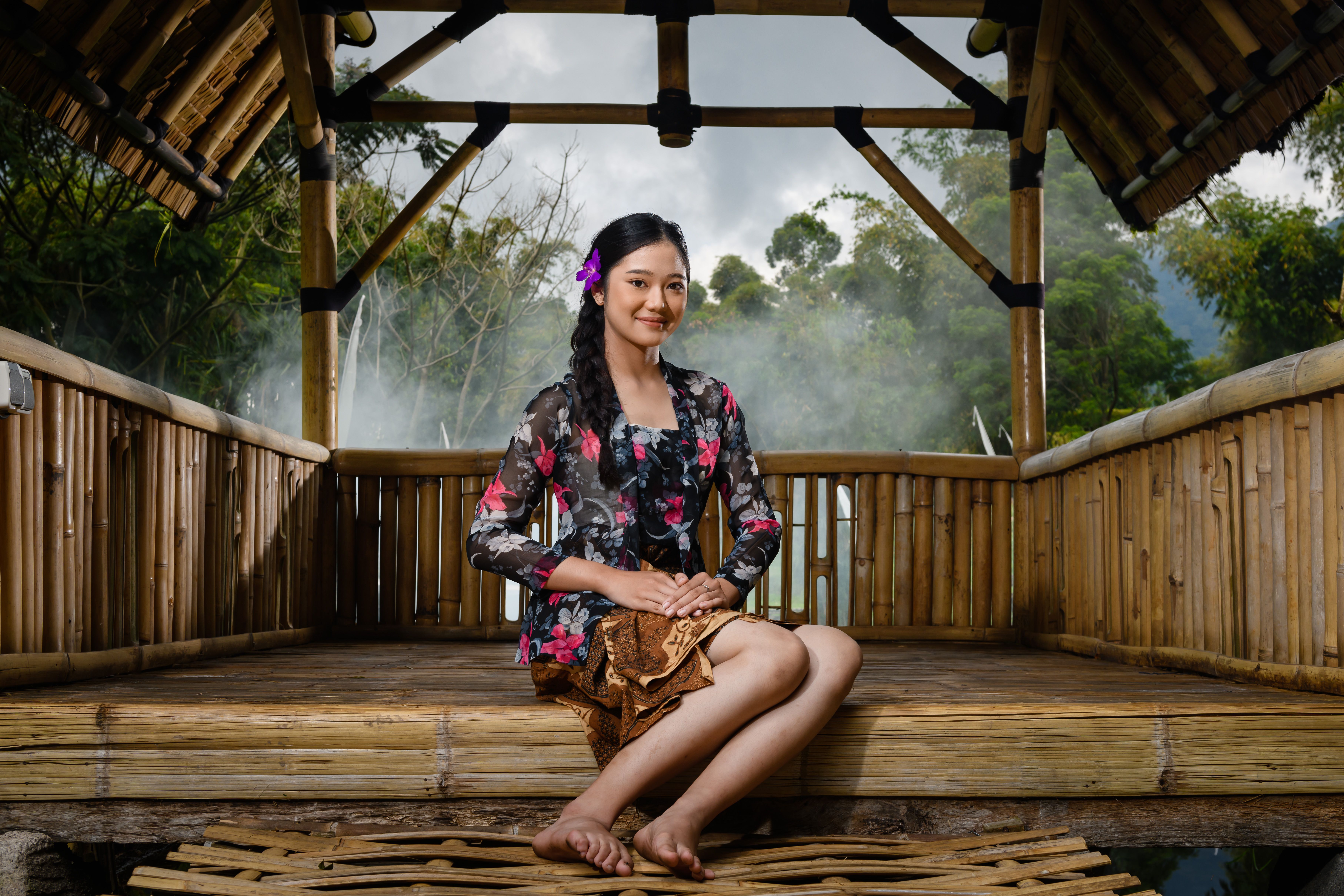 Elegant Woman Posing in Traditional Indonesian Bamboo Hut · Free Stock ...