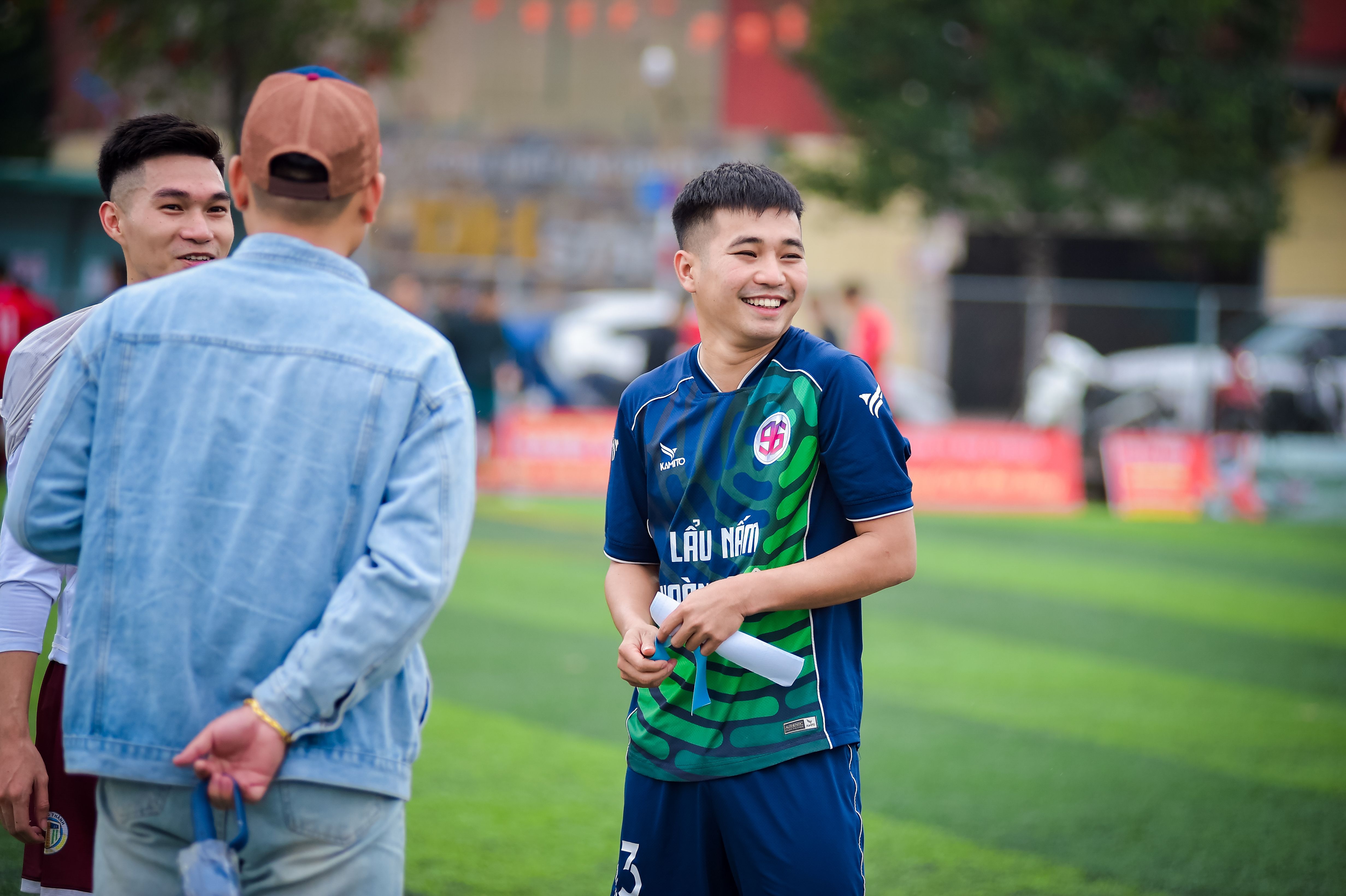 Young Footballer Smiling on Hanoi Soccer Field · Free Stock Photo