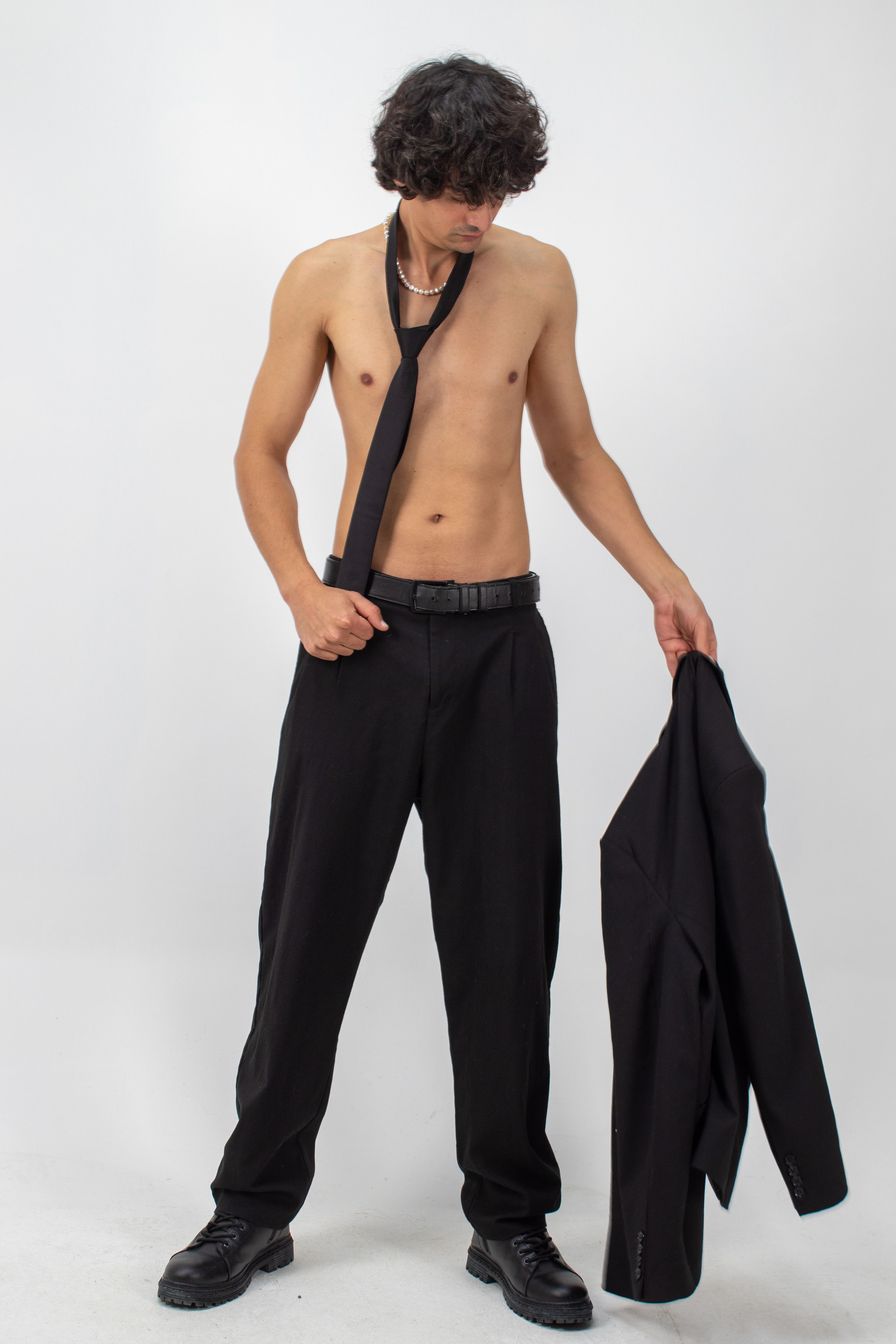 Shirtless Man with Suit in Art Studio Pose · Free Stock Photo