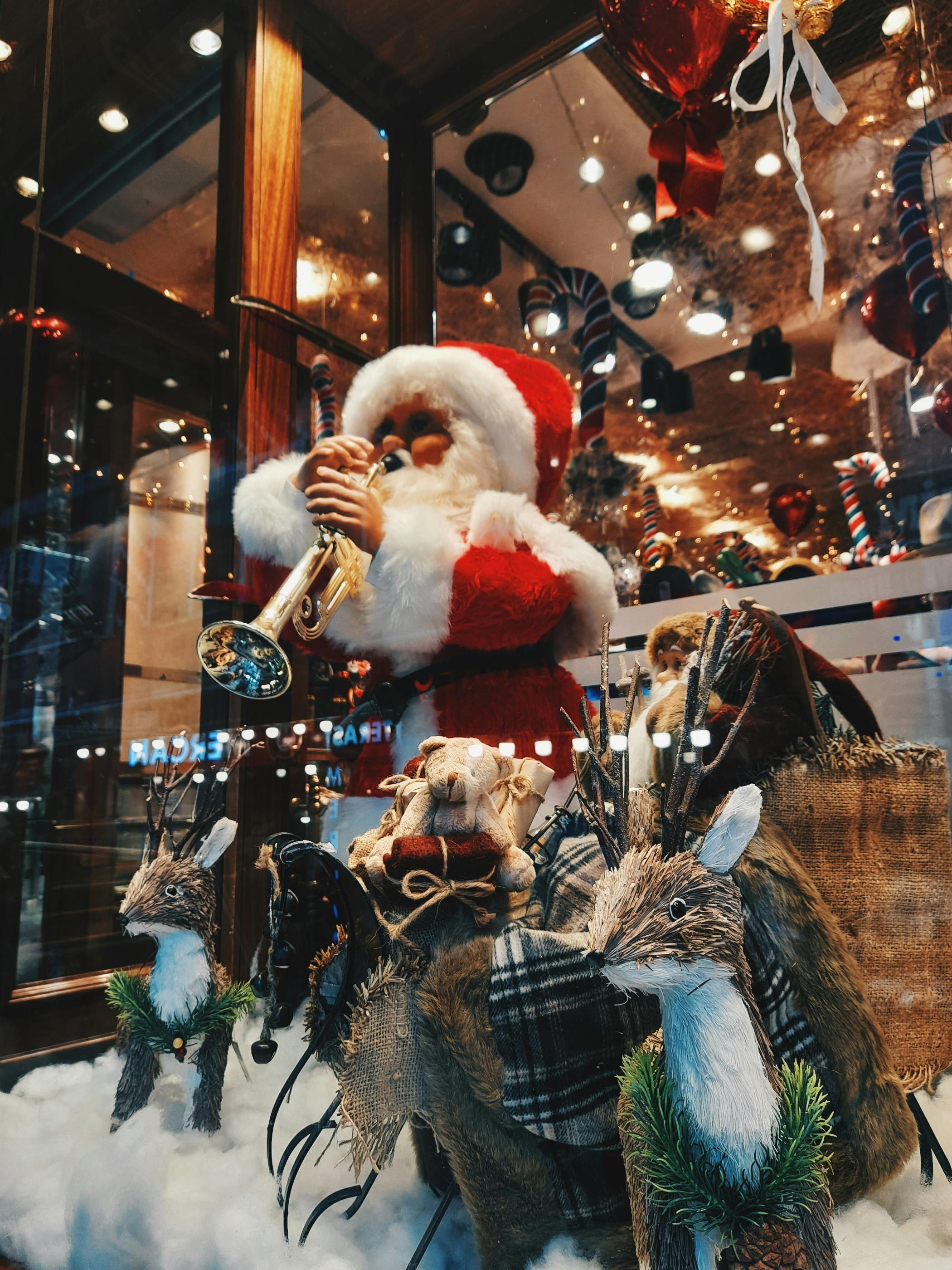 Festive Christmas Window Display with Santa Claus · Free Stock Photo