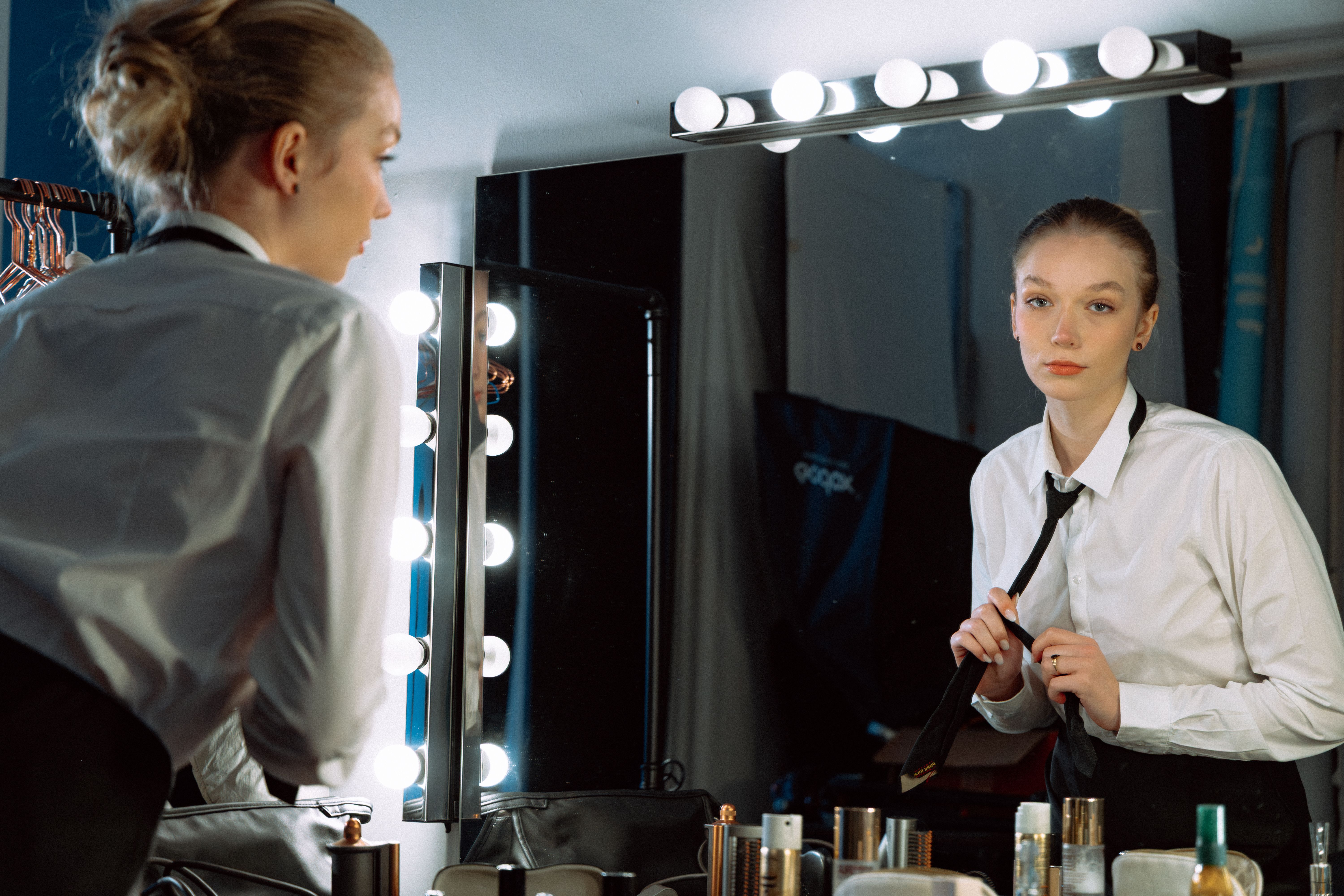 Young Woman Preparing for a Performance Backstage · Free Stock Photo