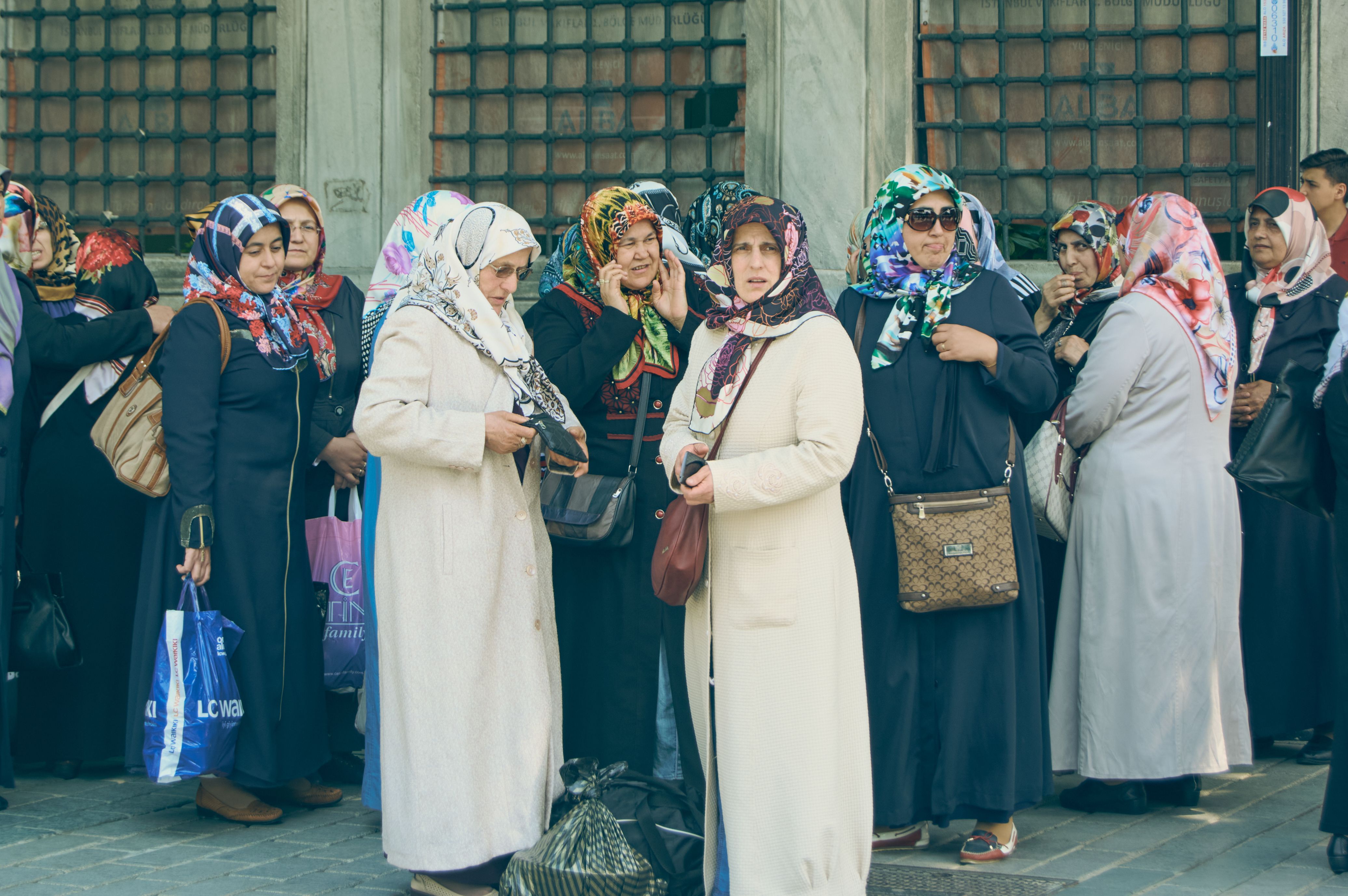 Women in Traditional Clothing Gathering Outdoors · Free Stock Photo