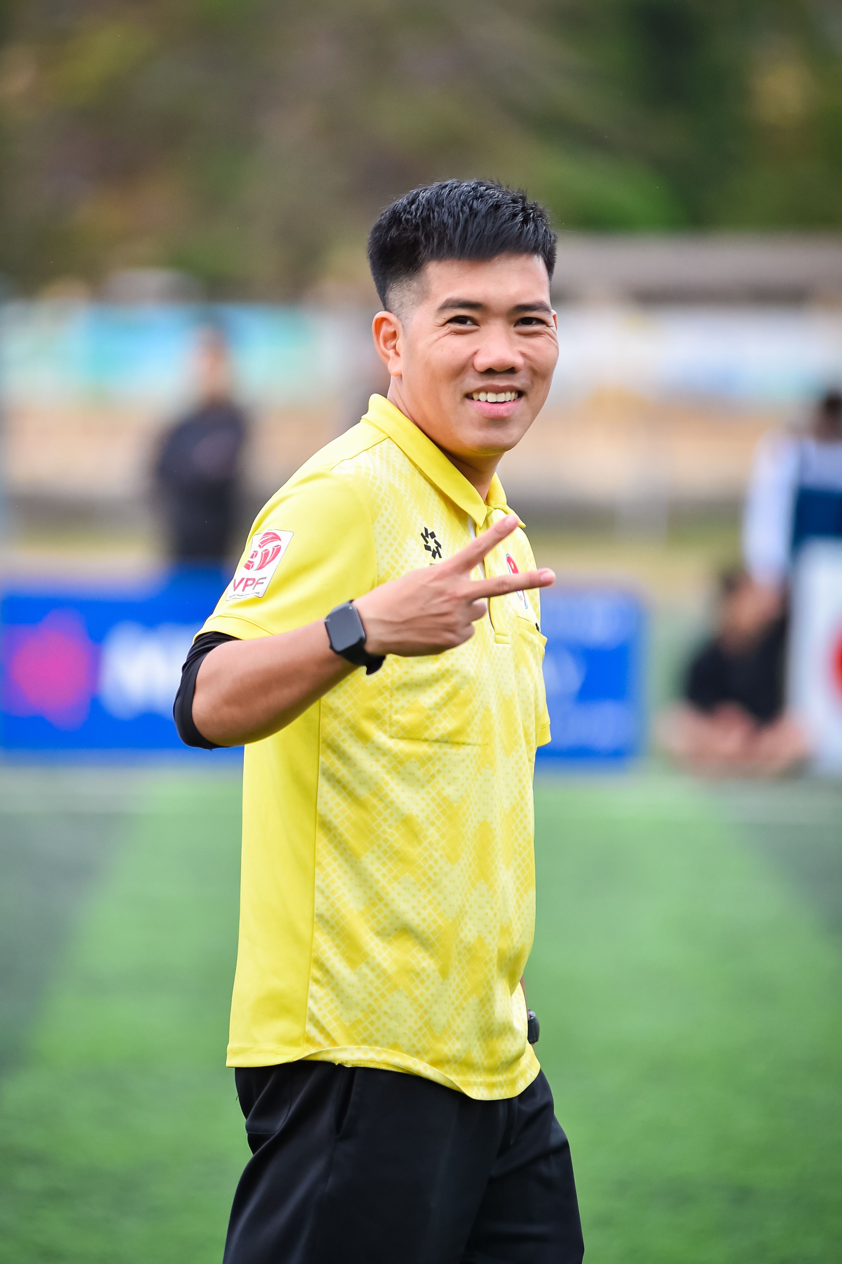 Happy Football Referee Giving Peace Sign Outdoors · Free Stock Photo