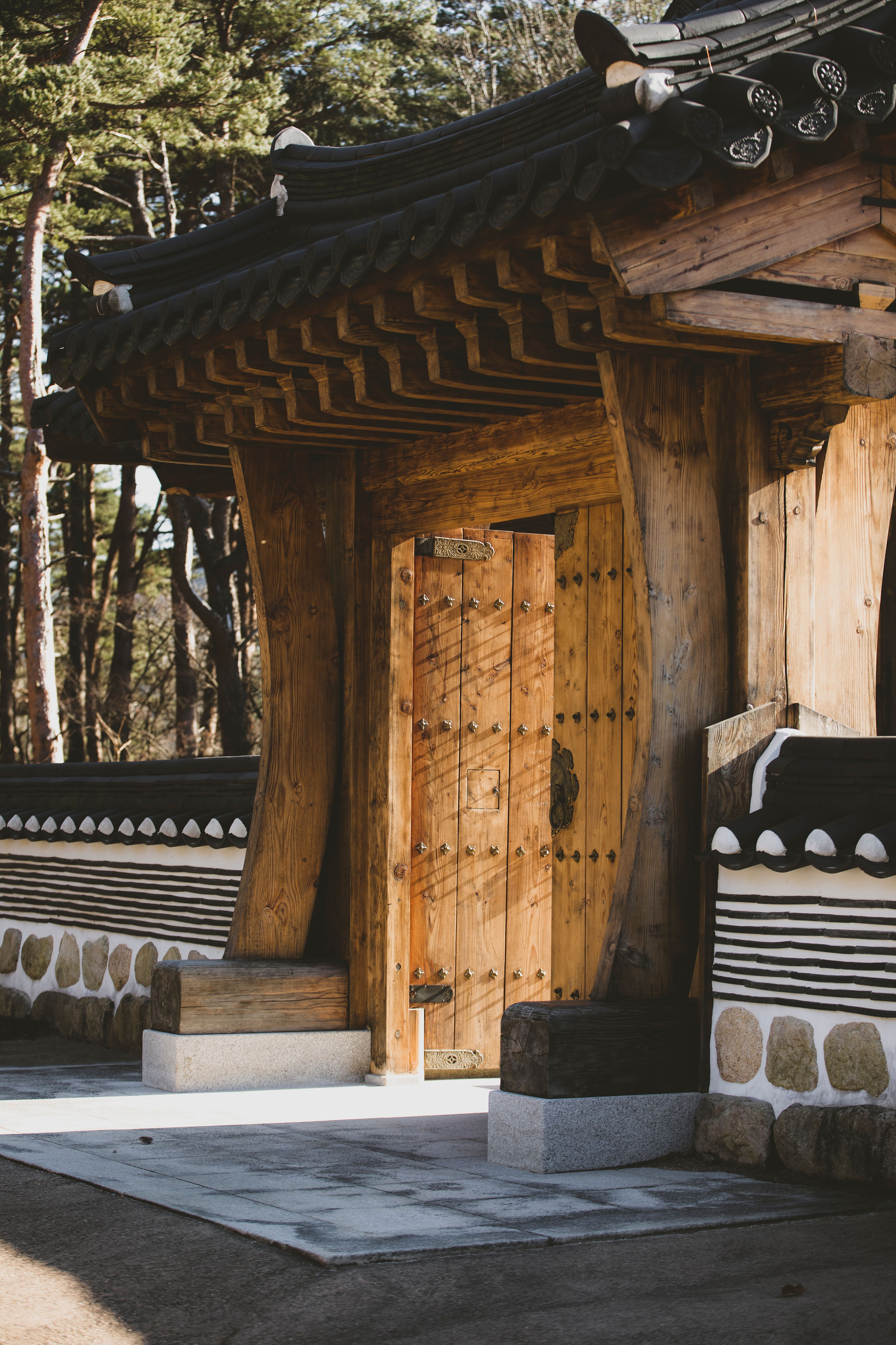 Traditional Korean Gate in Scenic Forest Setting · Free Stock Photo