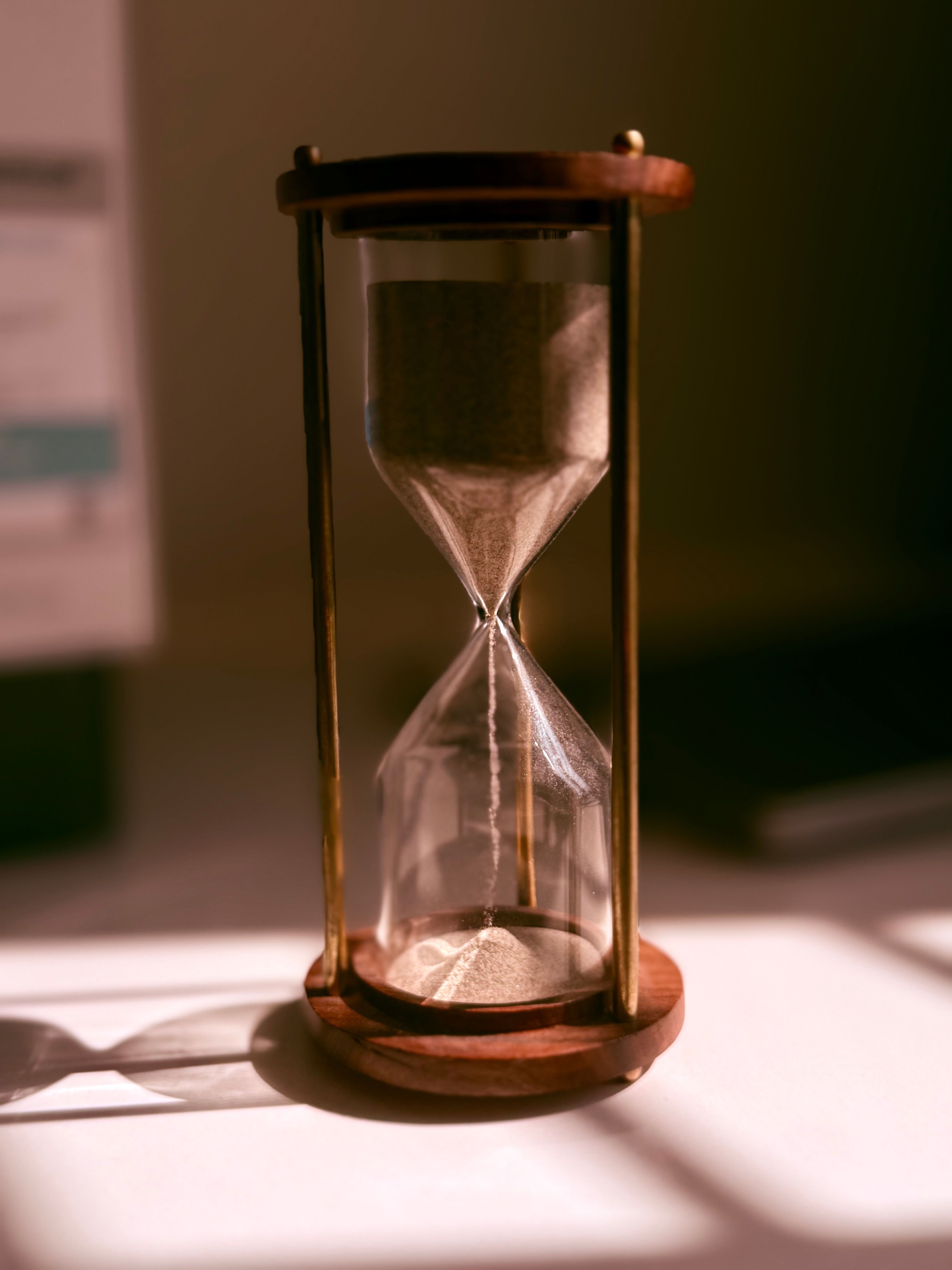 Elegant Wooden Hourglass in Soft Sunlight · Free Stock Photo