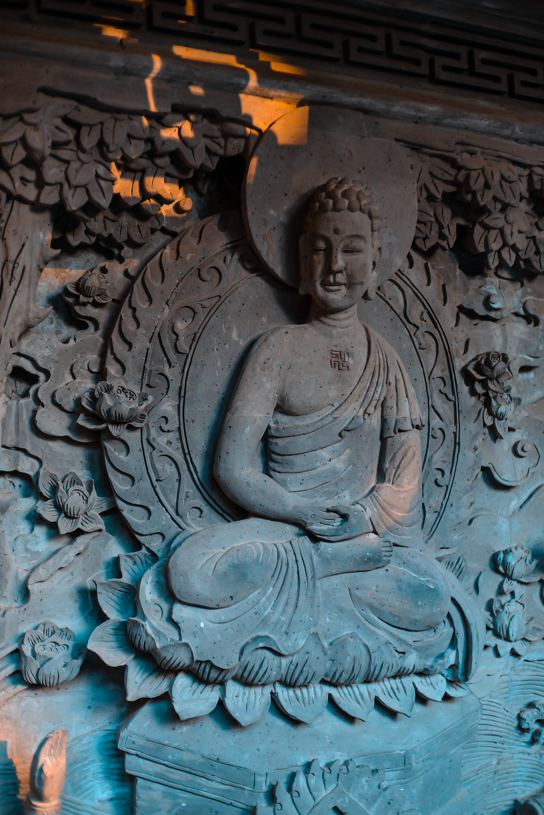 Intricate Stone Buddha Bas-Relief Sculpture with Floral Motifs · Free ...