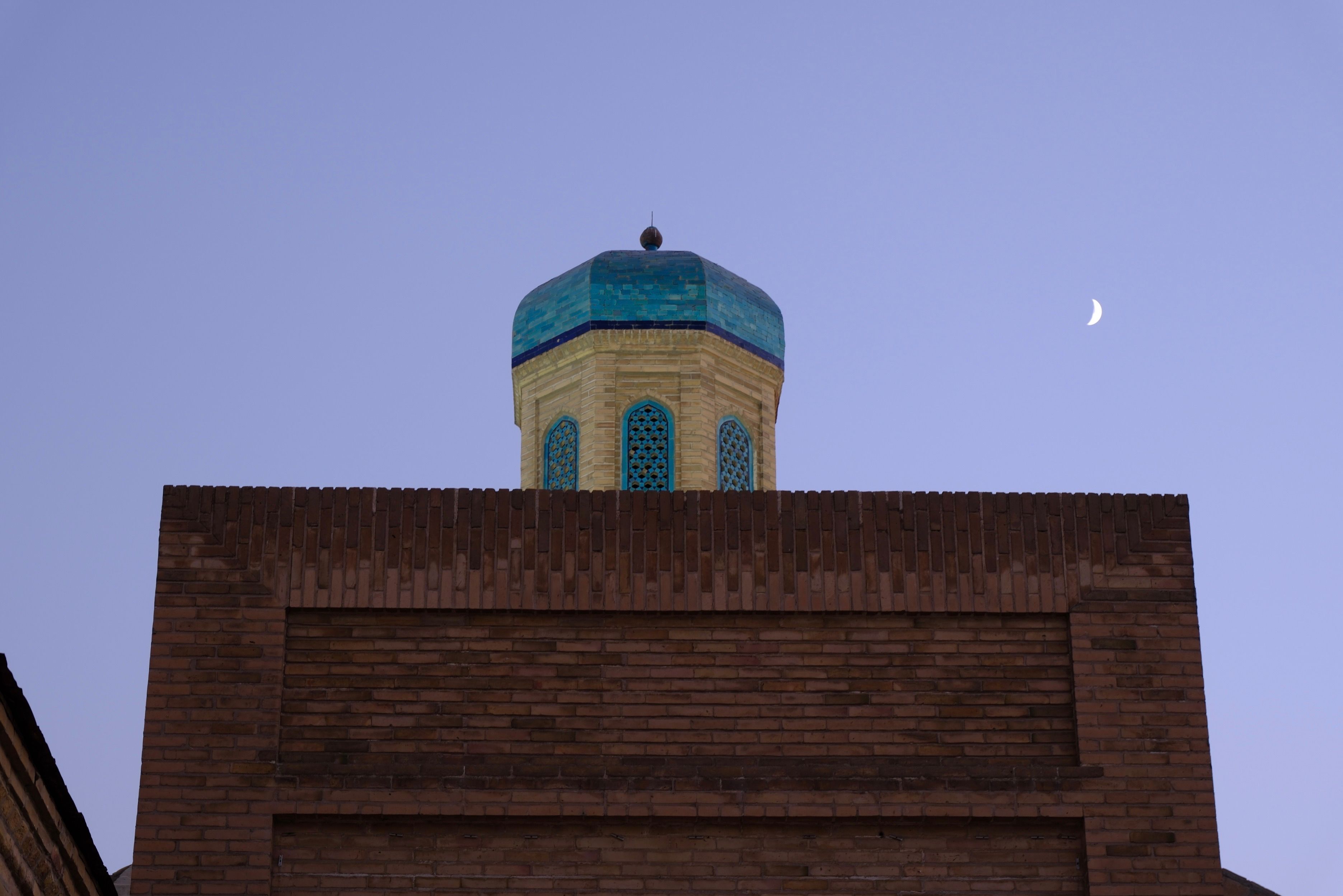 Iconic Brick Architecture with Crescent Moon · Free Stock Photo